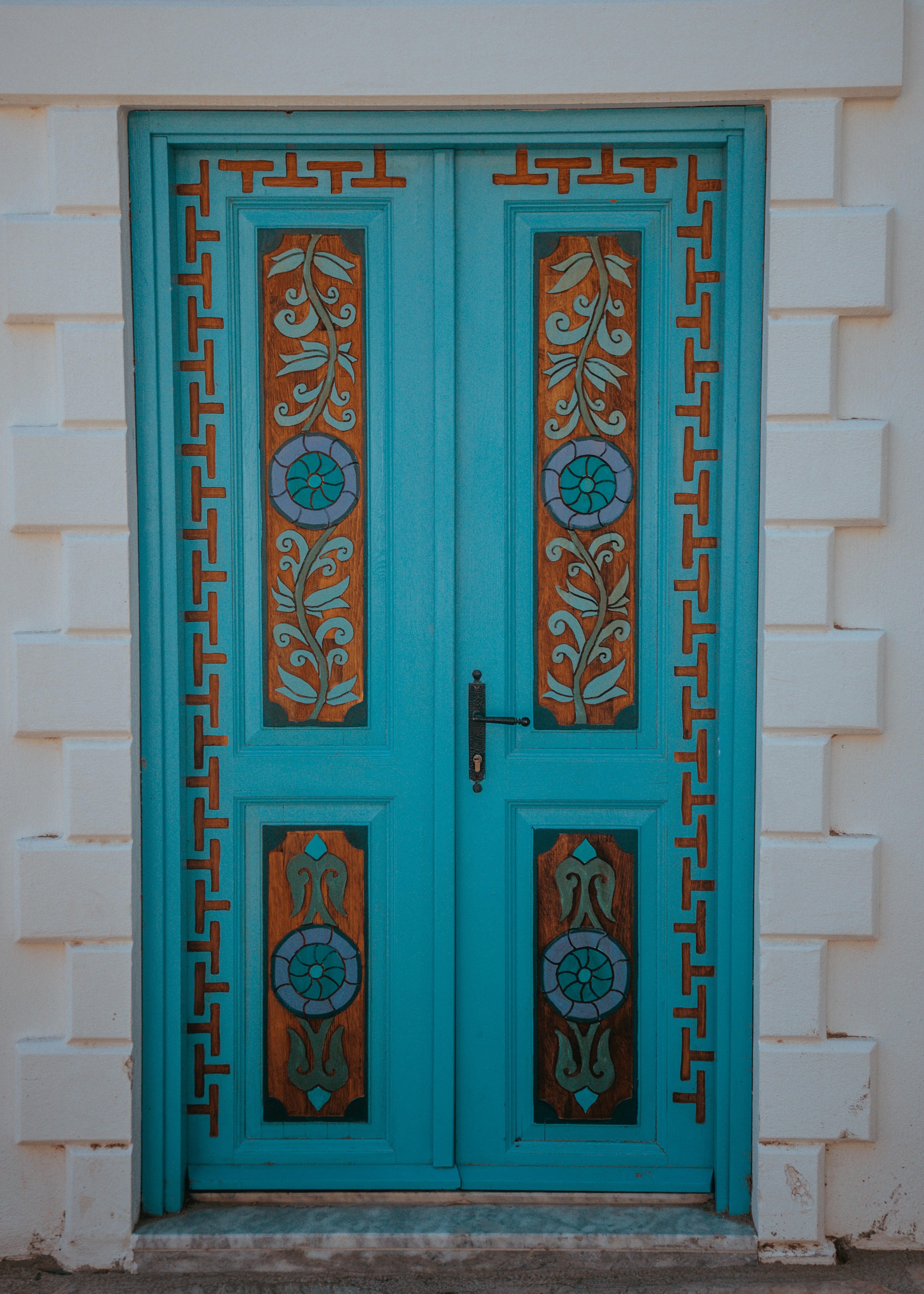 Old Double Door Painted Blue with Decorative Patterns · Free Stock Photo