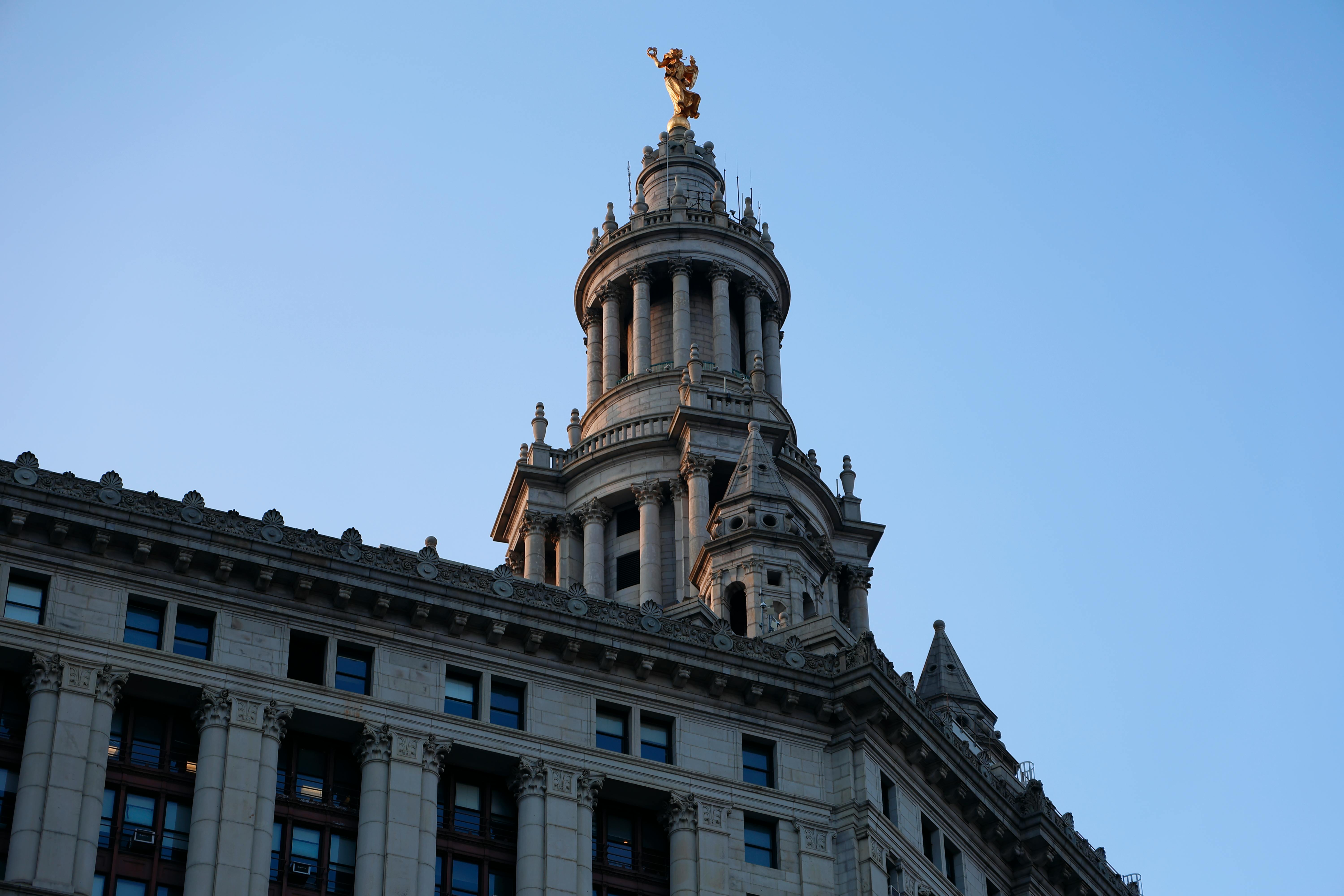Low Angle Shot of a Gray Tower · Free Stock Photo