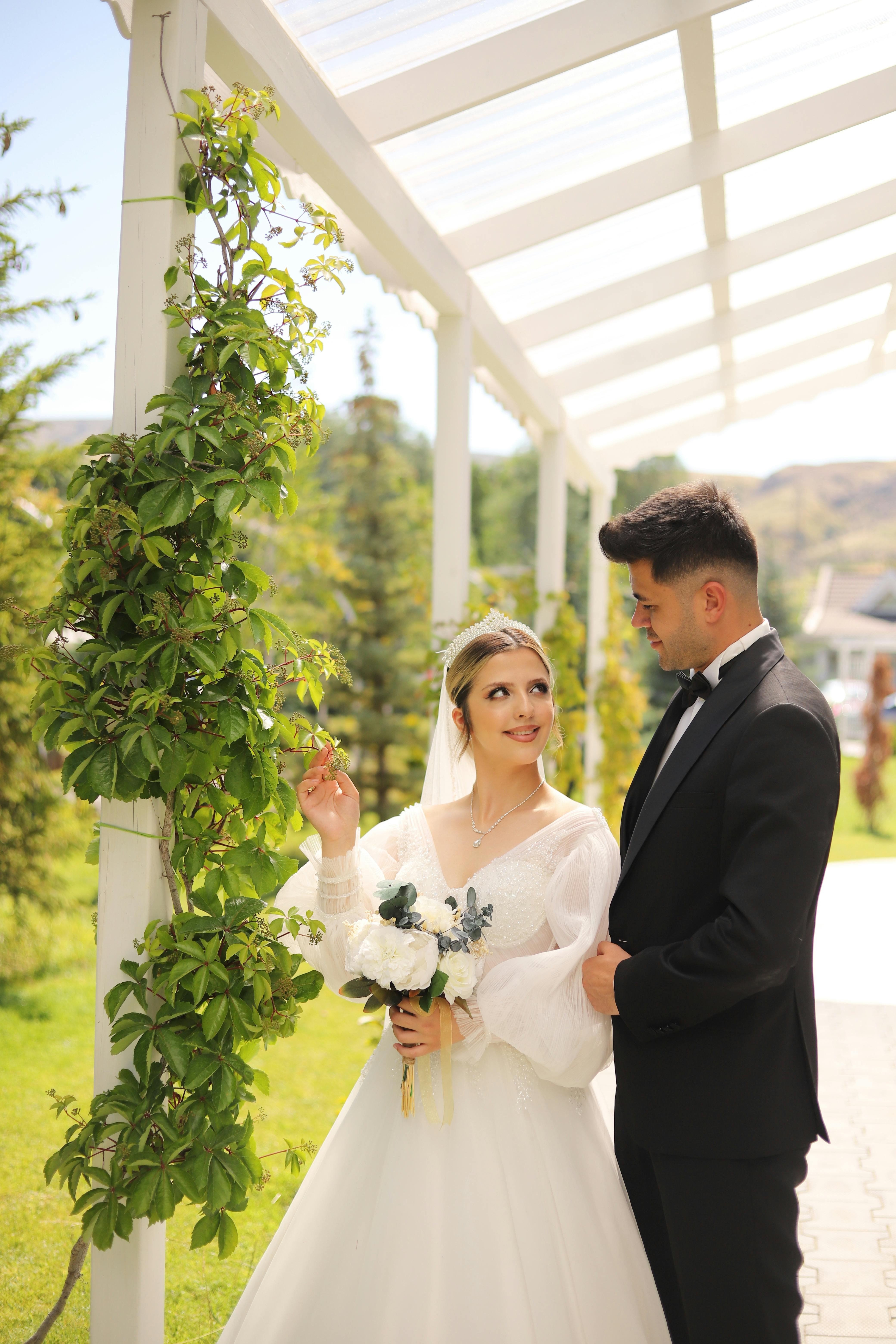 Bride and Groom at a Wedding Reception · Free Stock Photo