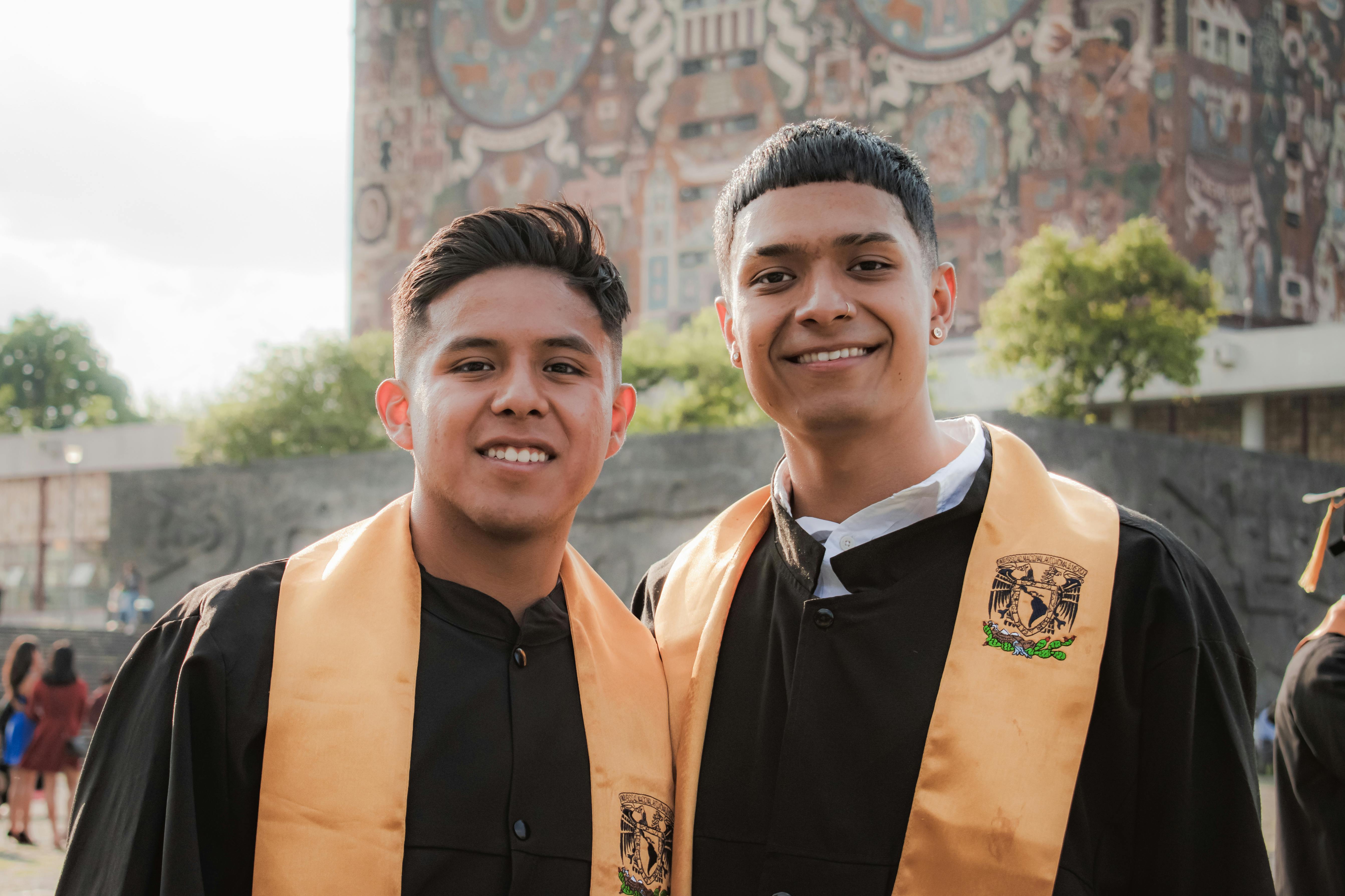 Smiling Graduates in Scarfs · Free Stock Photo
