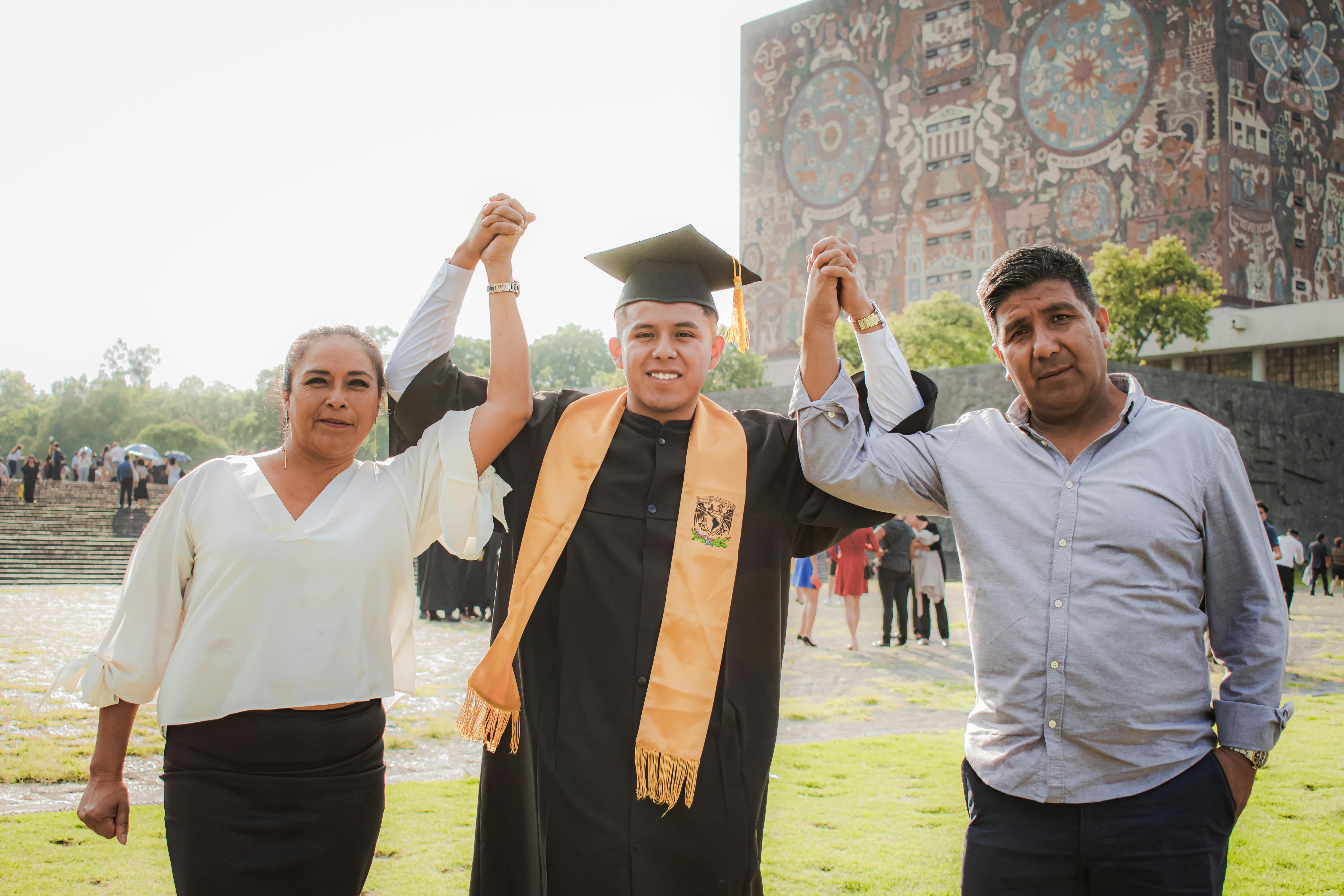 Graduate with Mother and Father · Free Stock Photo