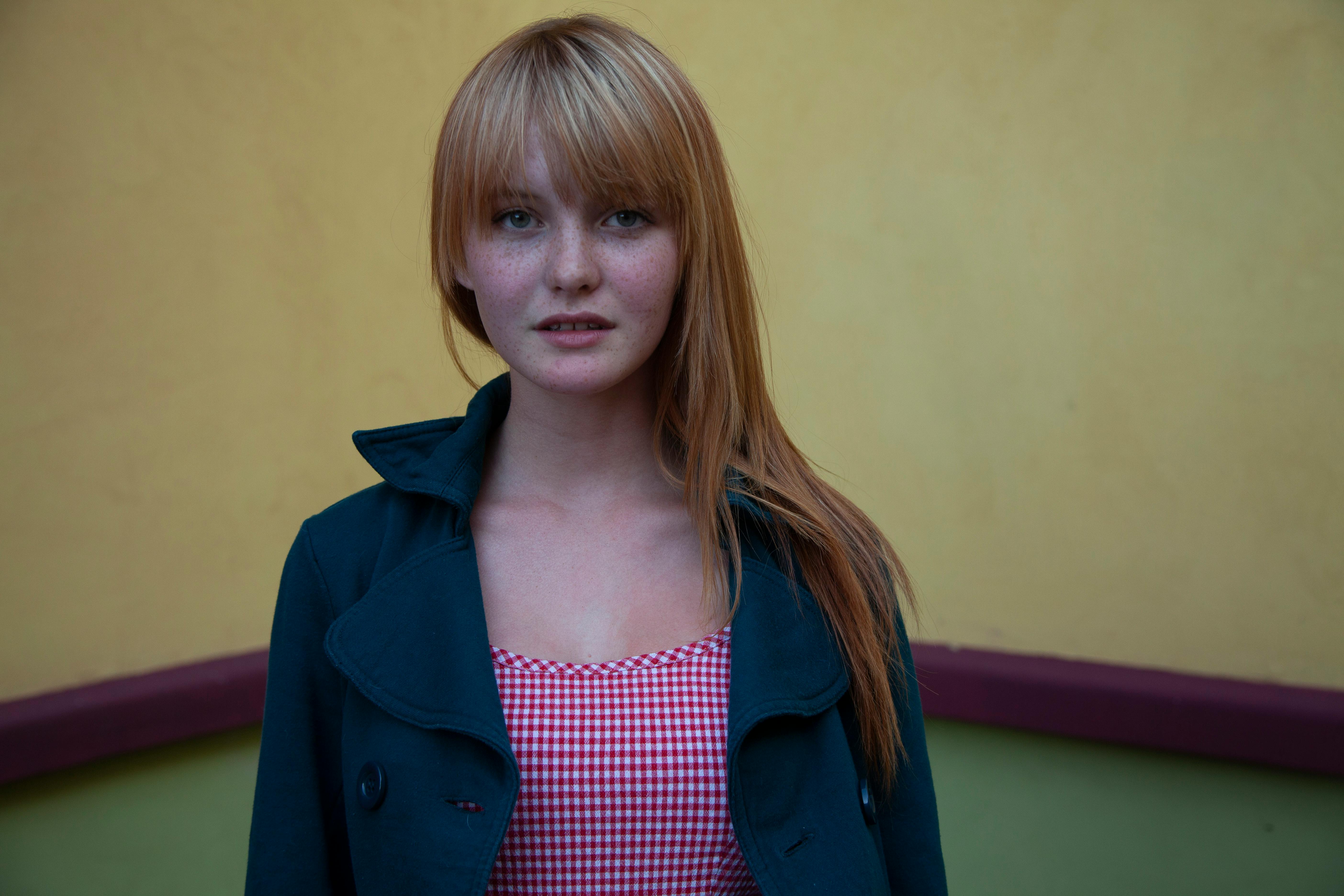 Young Brunette Woman in Black PVC Matrix Style Trench Coat Posing at a ...