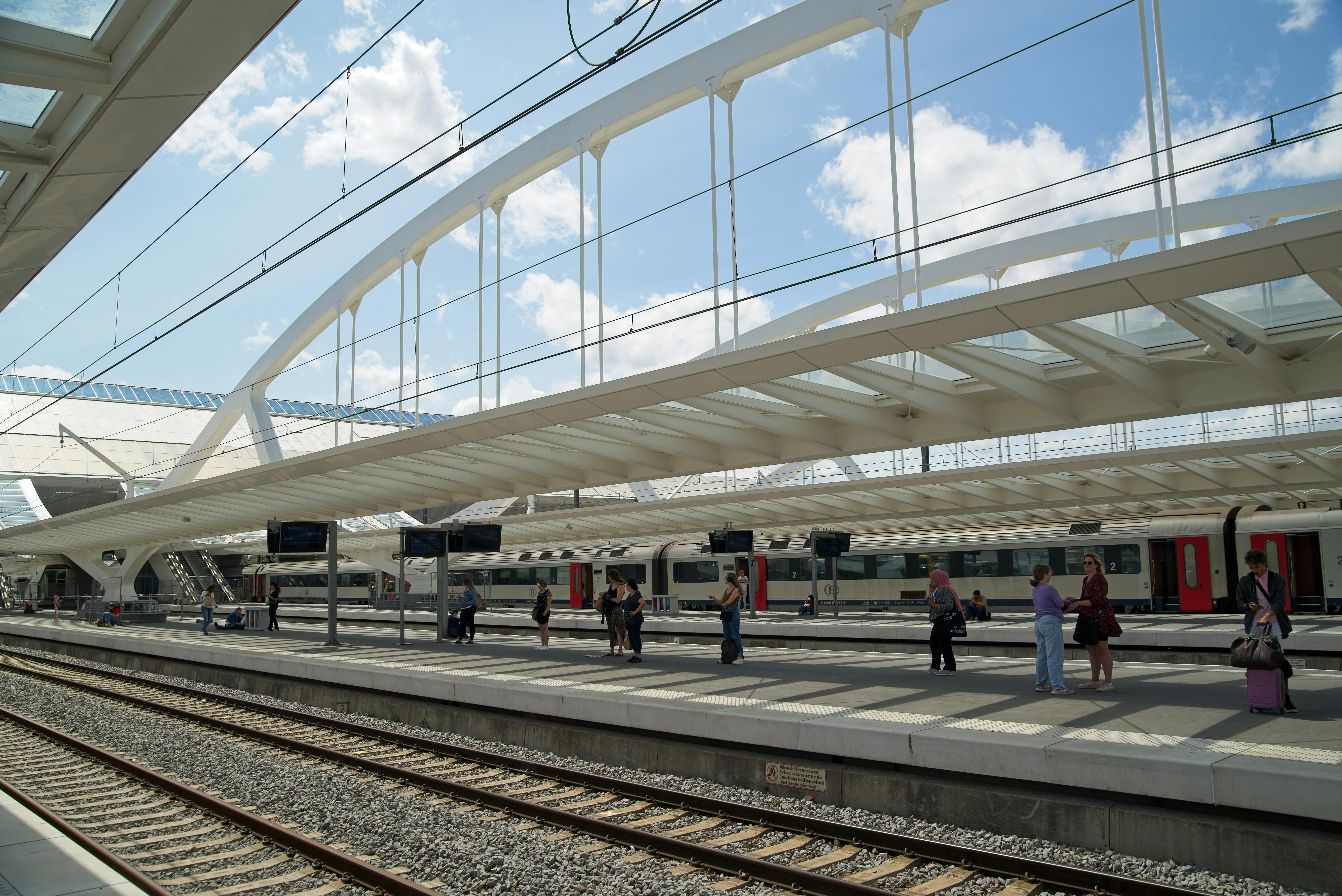 People Waiting at a Modern Railway Station Platform · Free Stock Photo