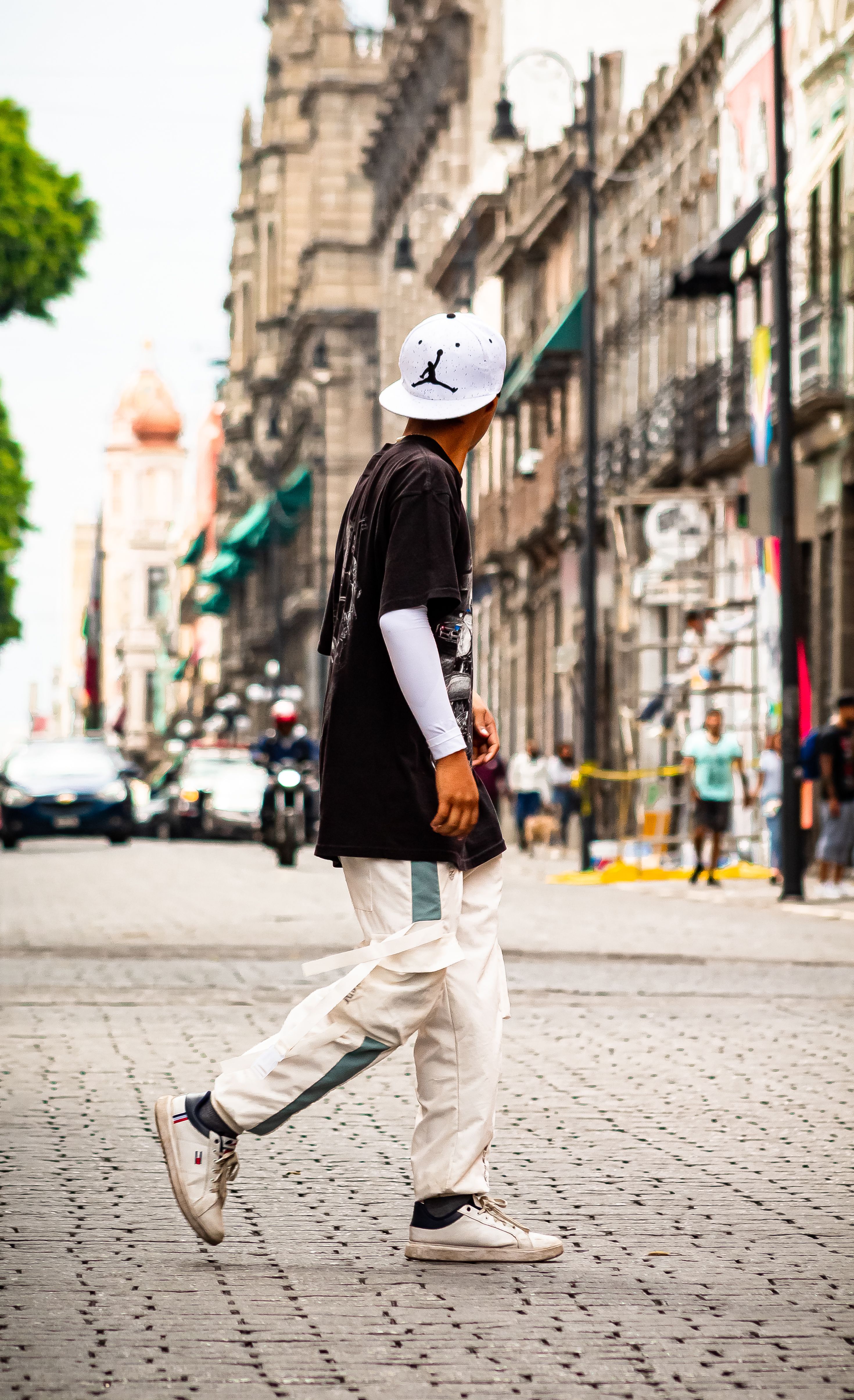 Man in Cap Crossing Street · Free Stock Photo