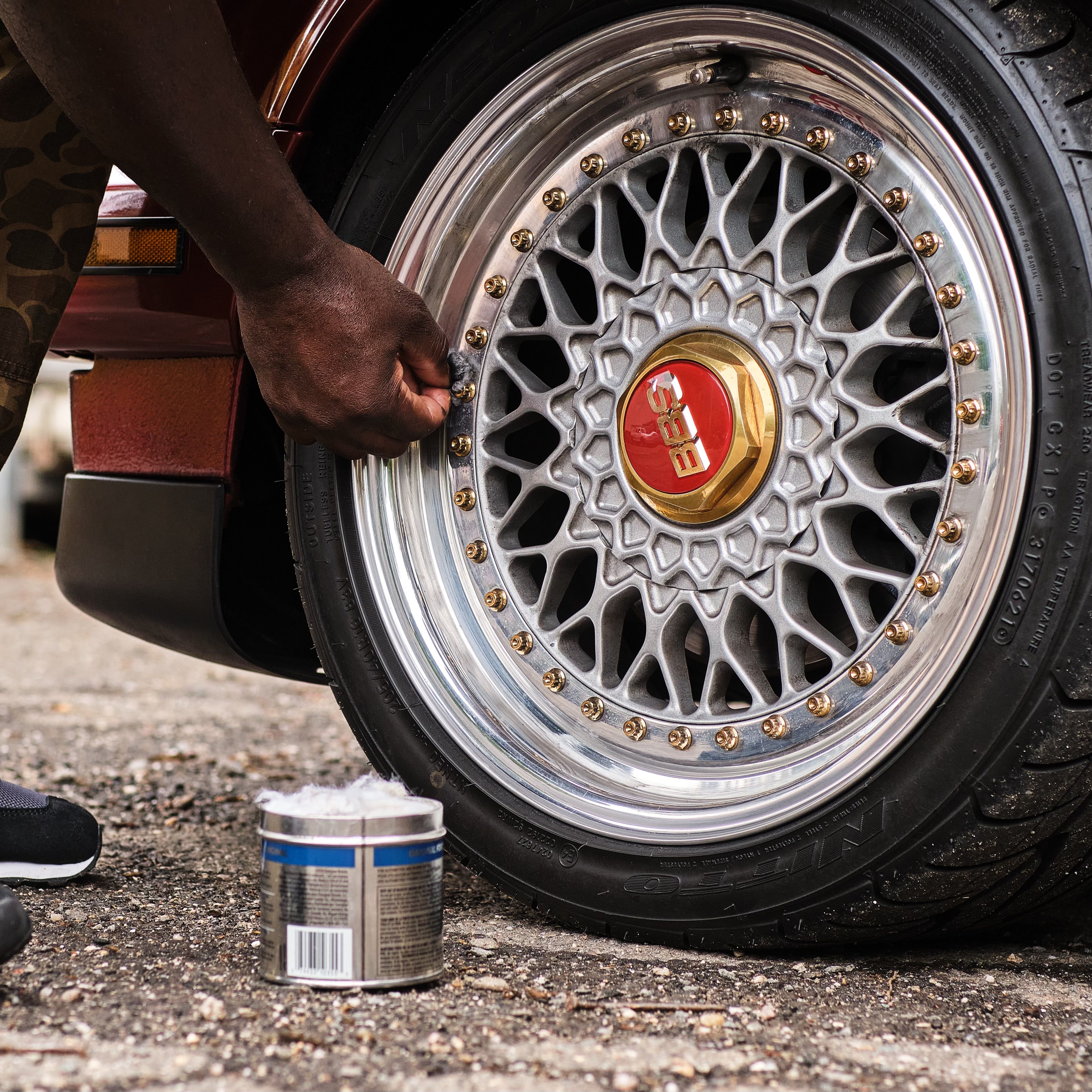 Close-up of Man Cleaning the Rim · Free Stock Photo
