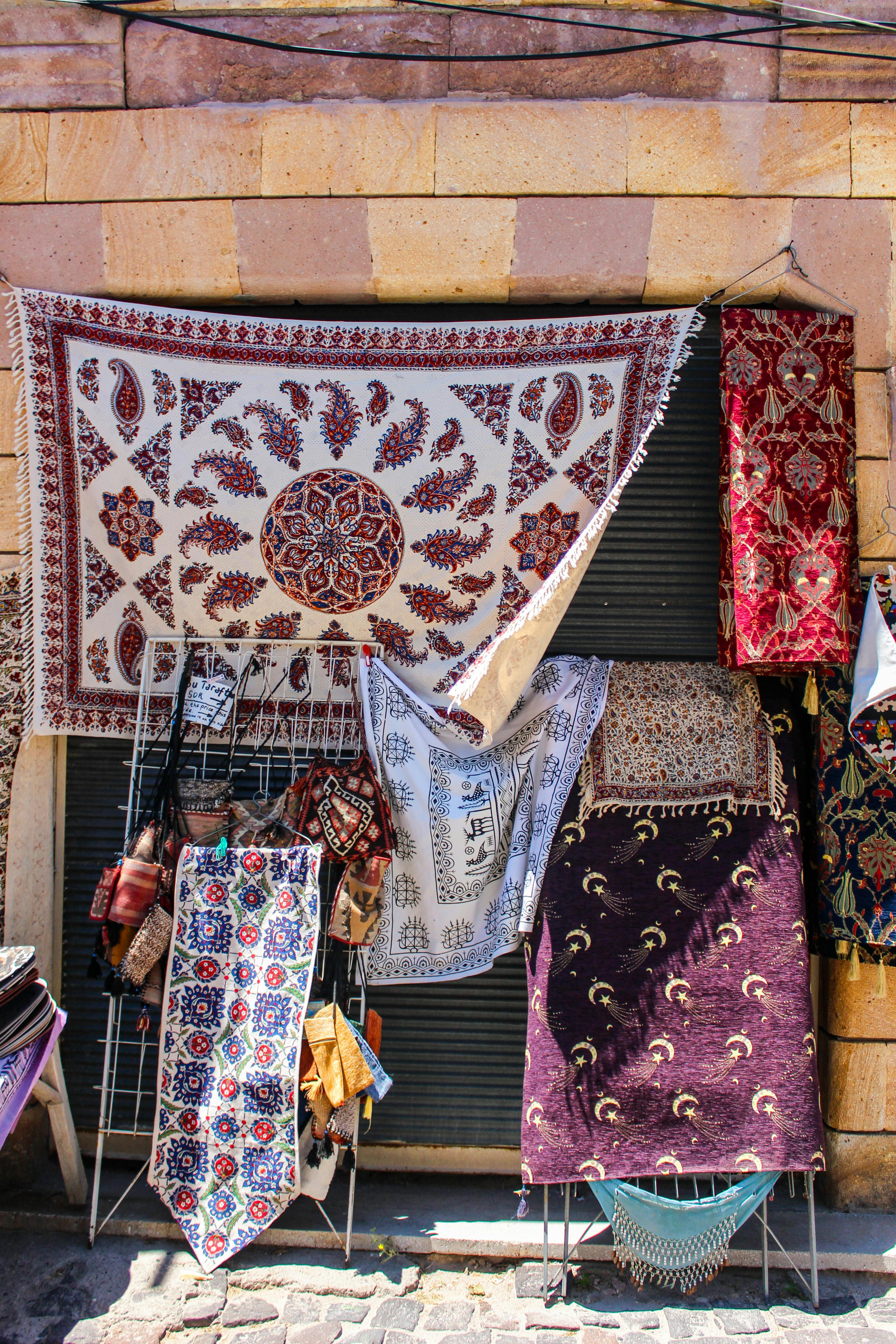 Rugs with Traditional Patterns on a Market Stall · Free Stock Photo