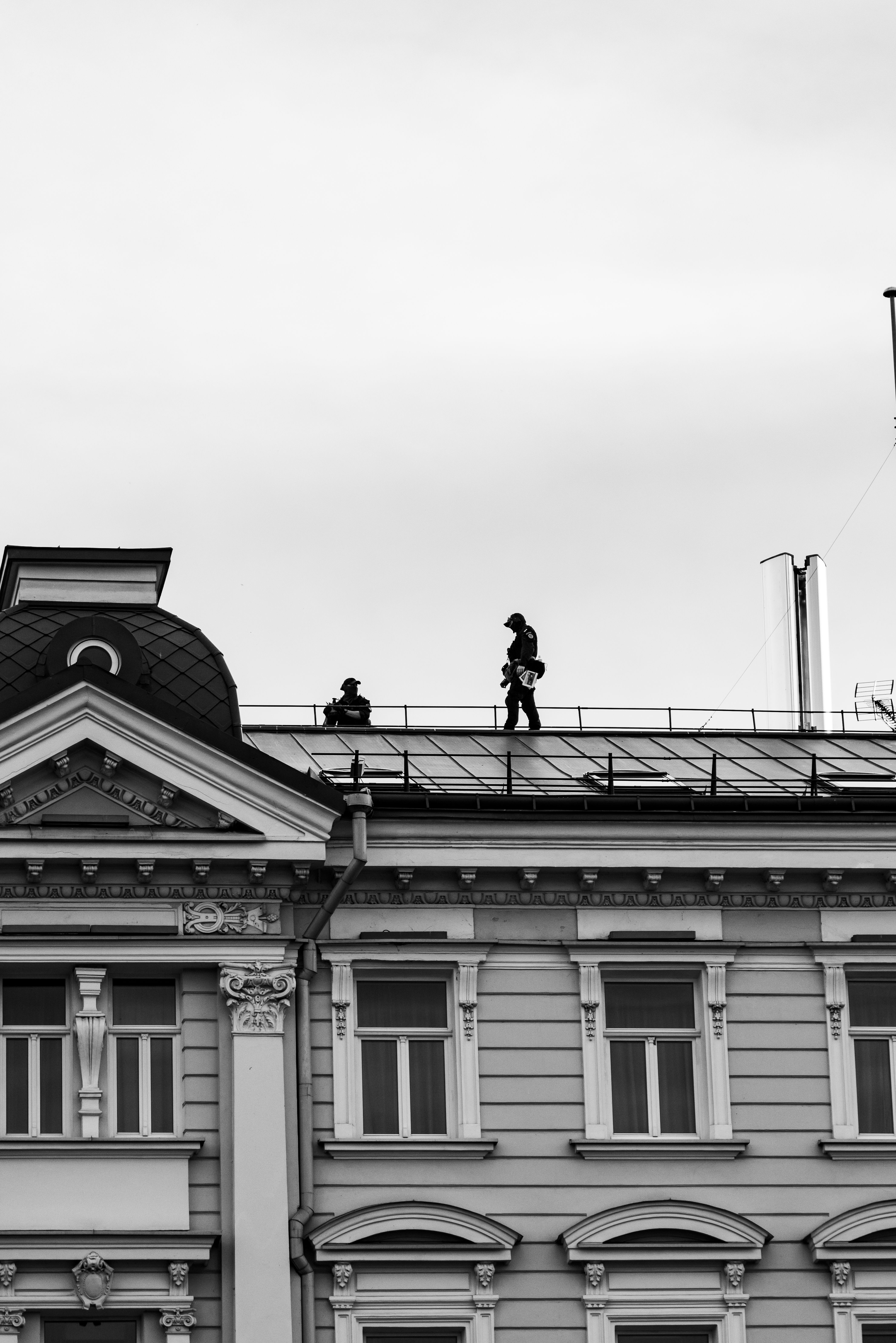 People Walking on a Roof · Free Stock Photo