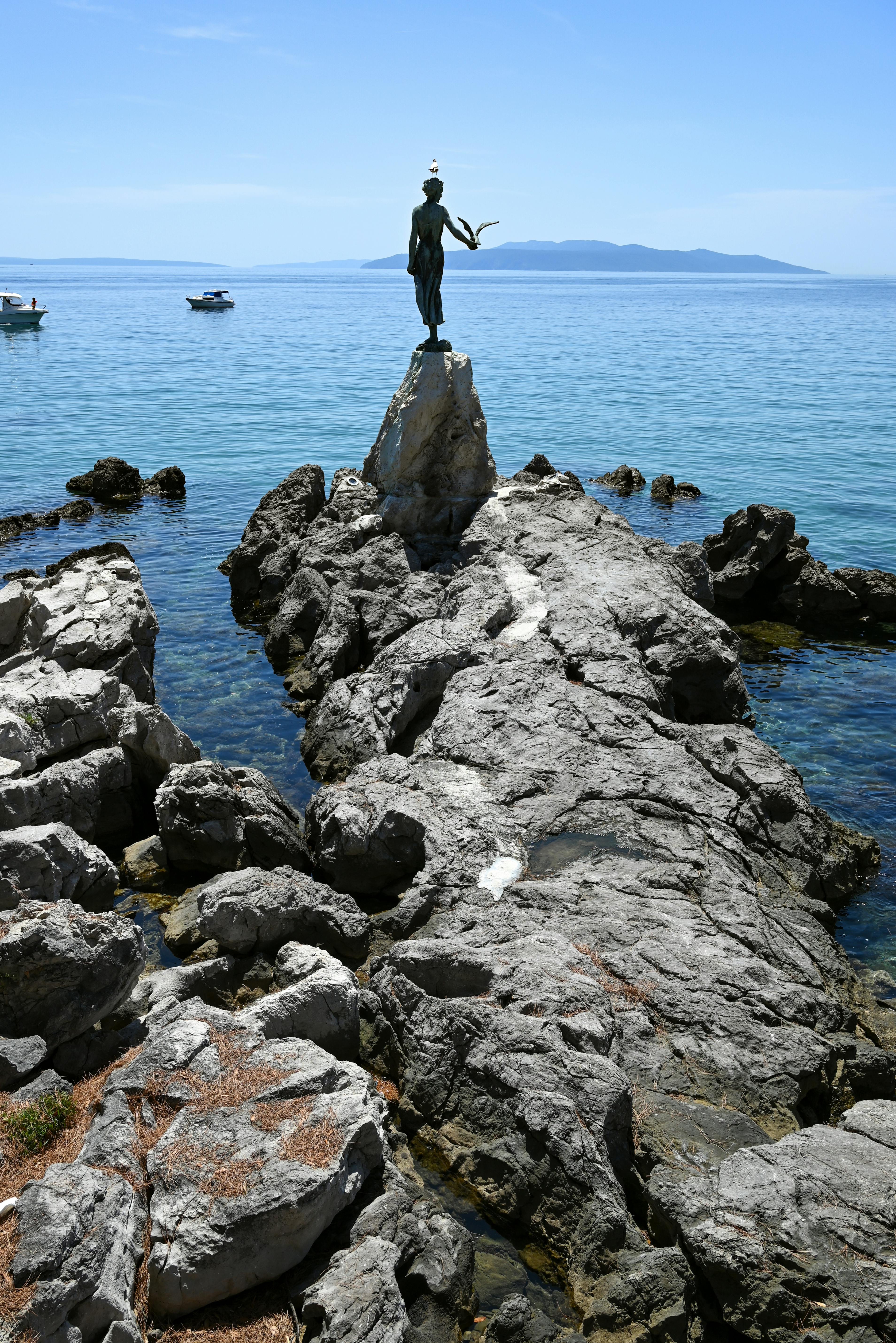 Statue on Rocks · Free Stock Photo