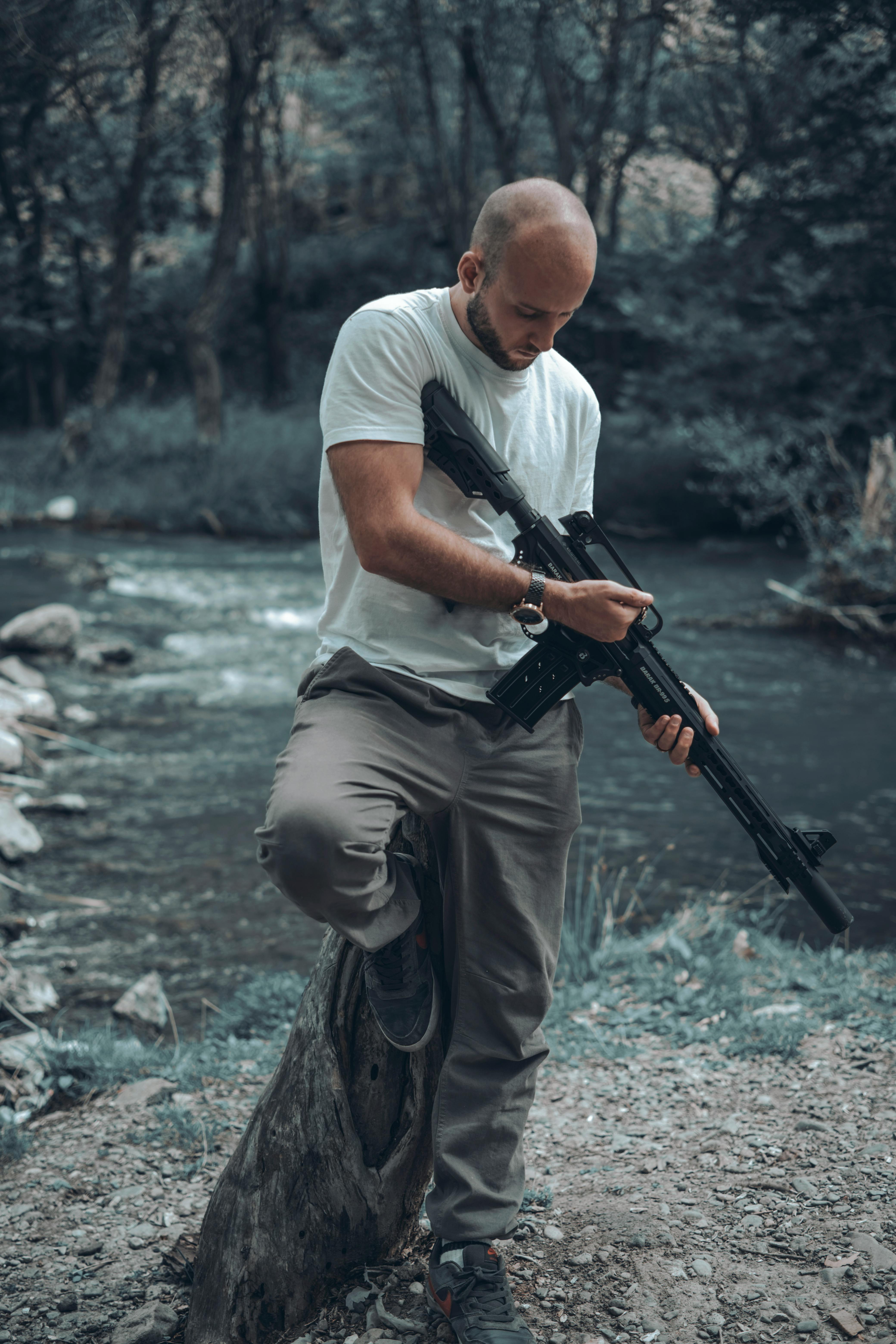 Man with Weapon in Forest · Free Stock Photo