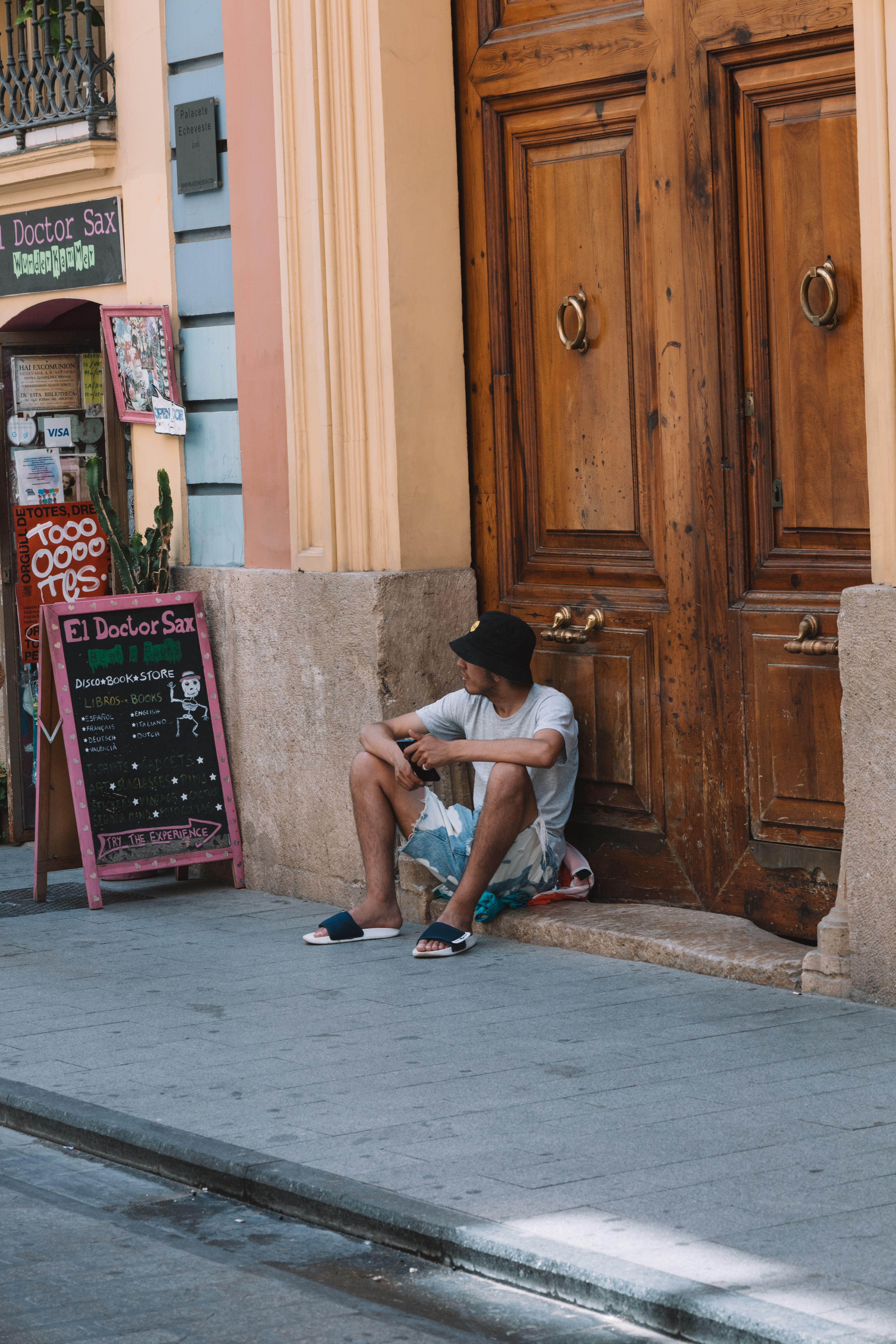Man Sitting on the Doorstep · Free Stock Photo