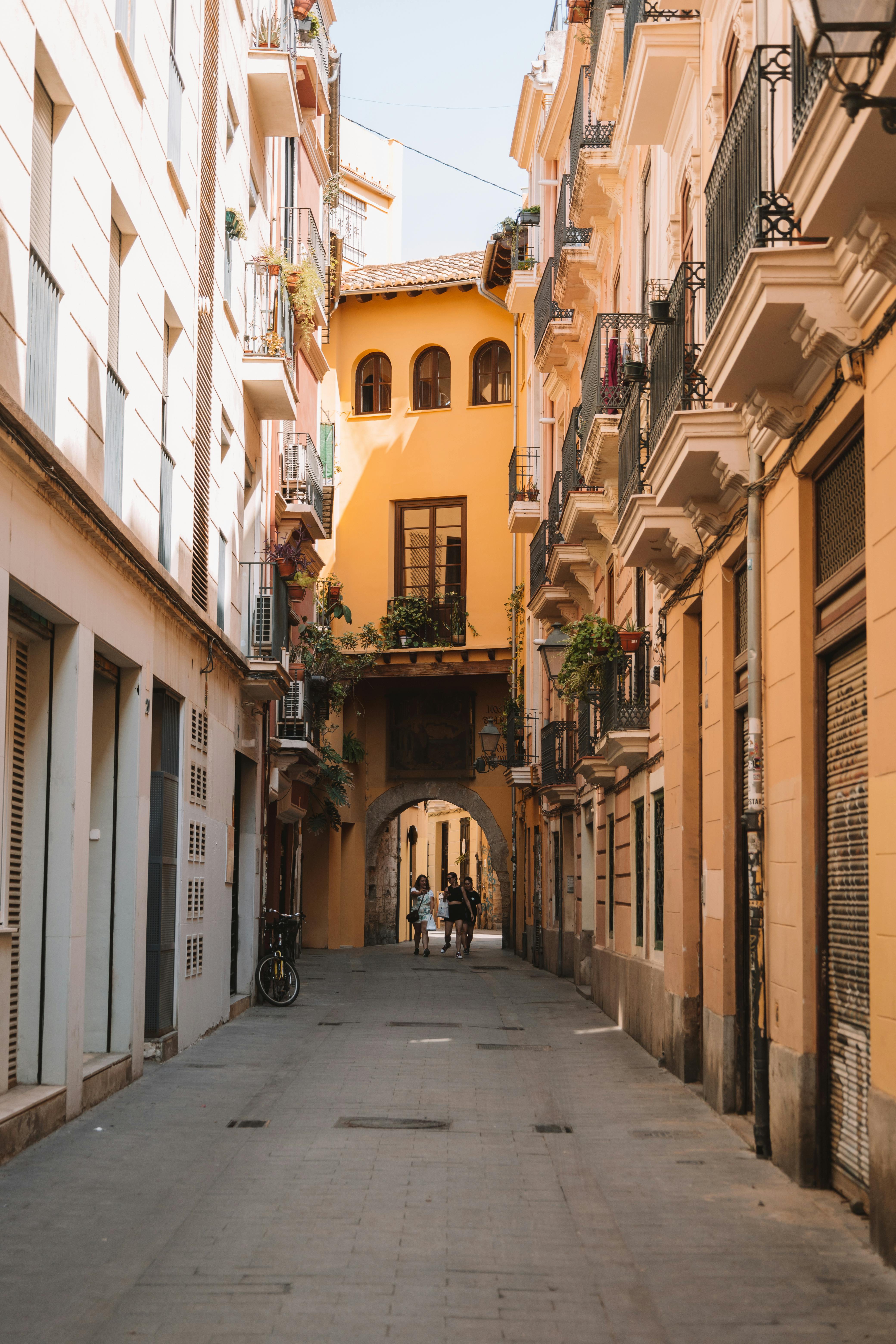 Buildings around Empty Street in Town · Free Stock Photo