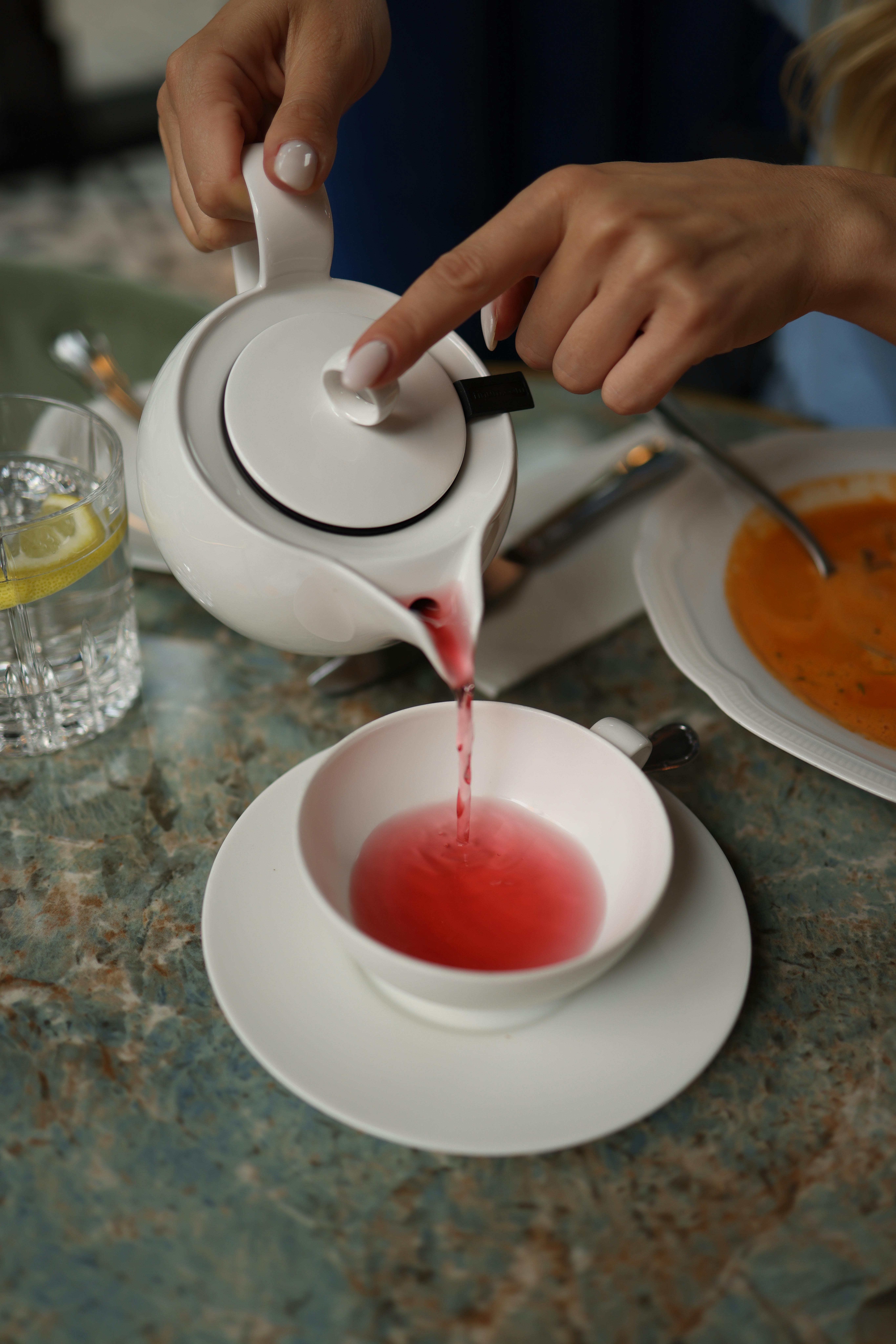 A Man Holding a Teapot · Free Stock Photo