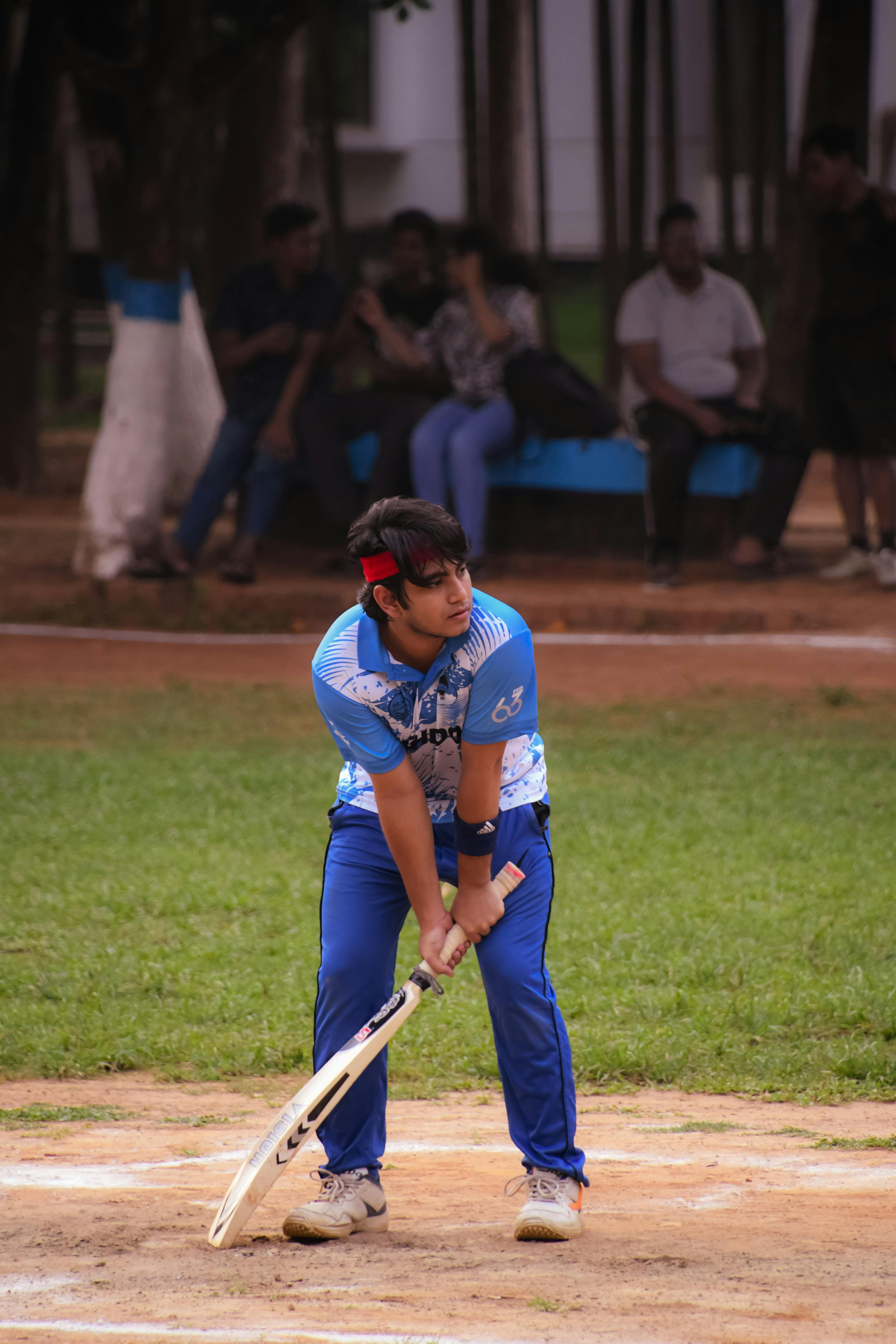 Cricketer practicing batting in sports gear · Free Stock Photo