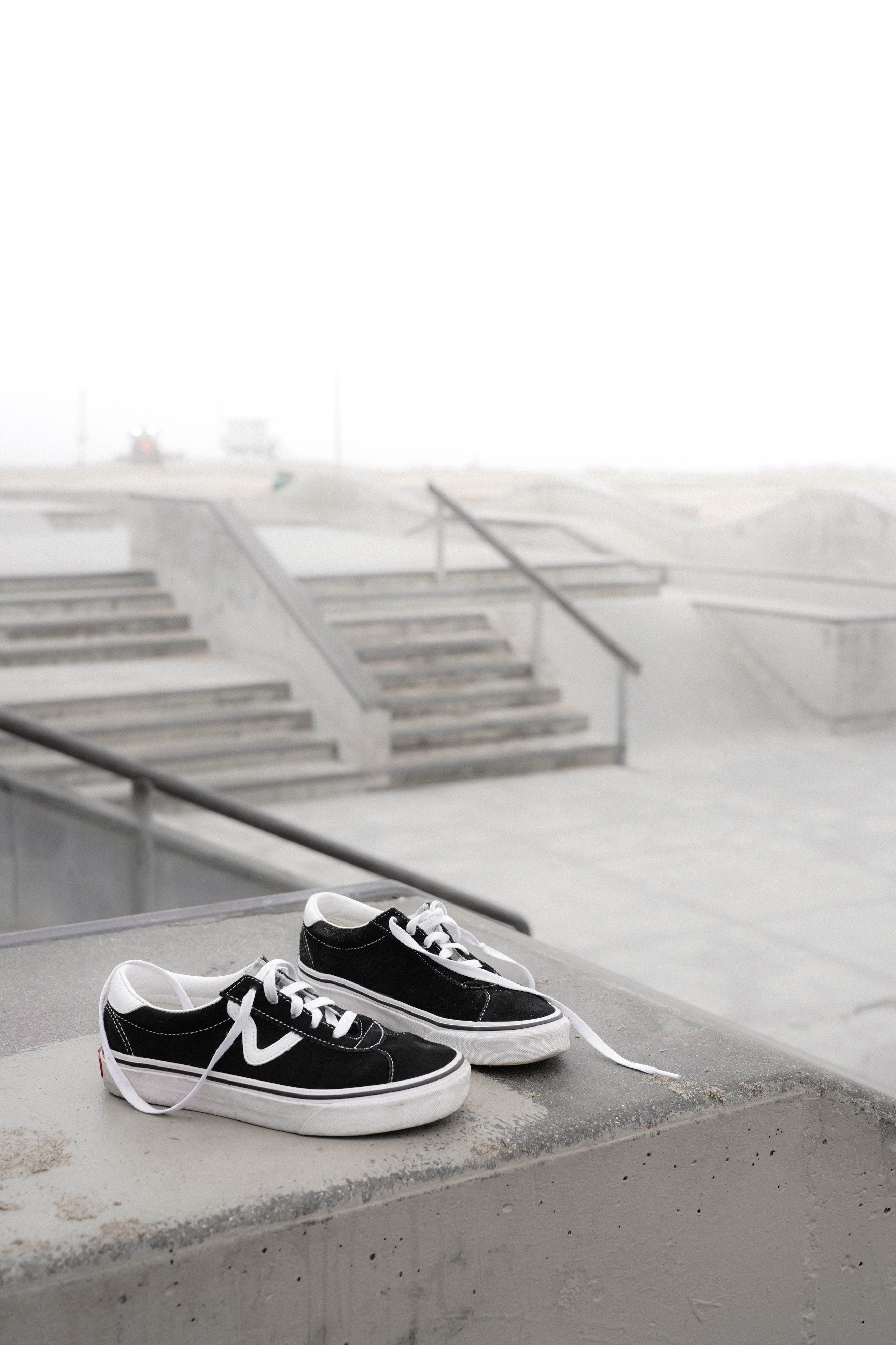 Vans Sneakers on Concrete Wall · Free Stock Photo