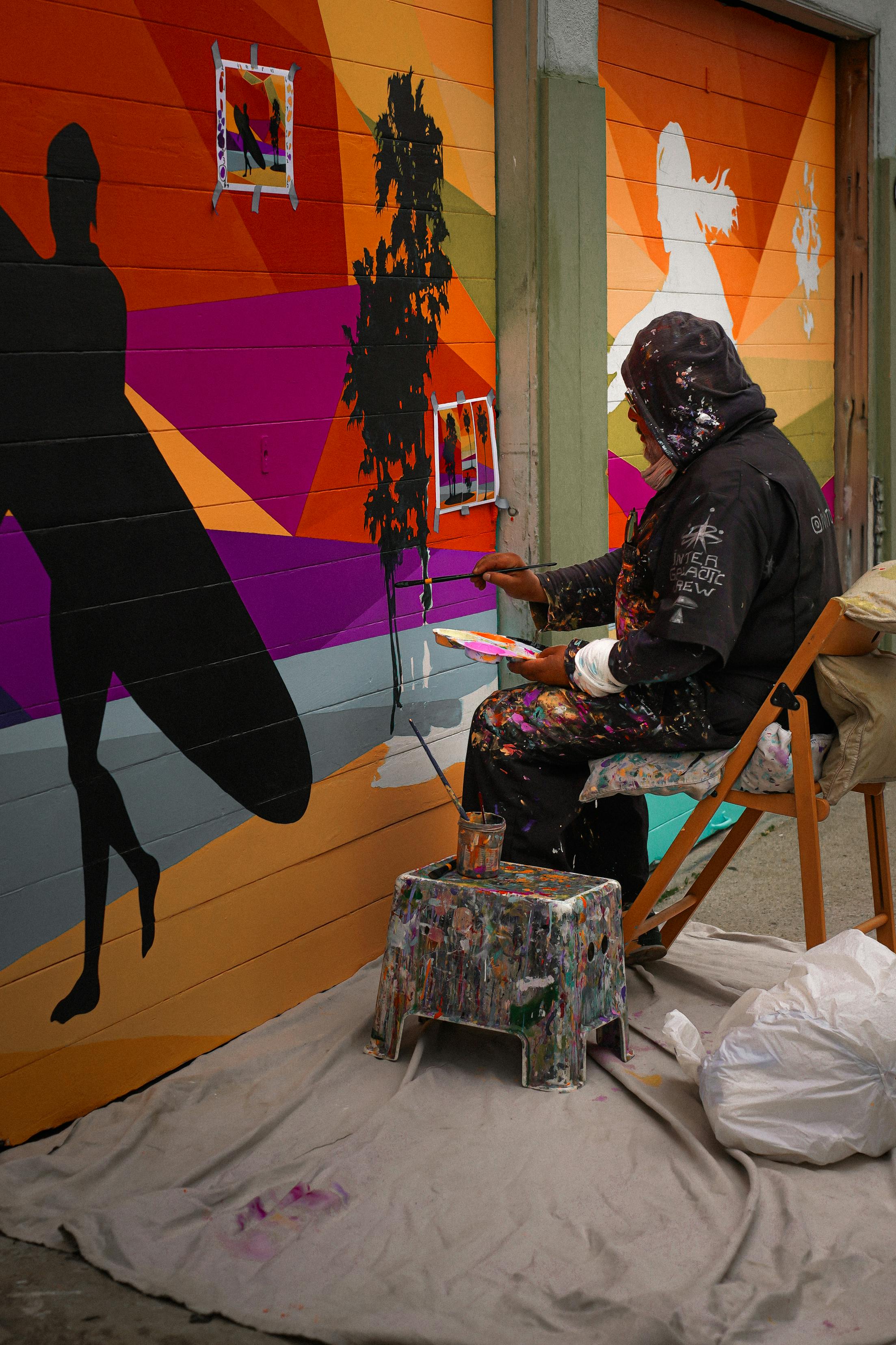 Photo of Woman Painting on Wall · Free Stock Photo