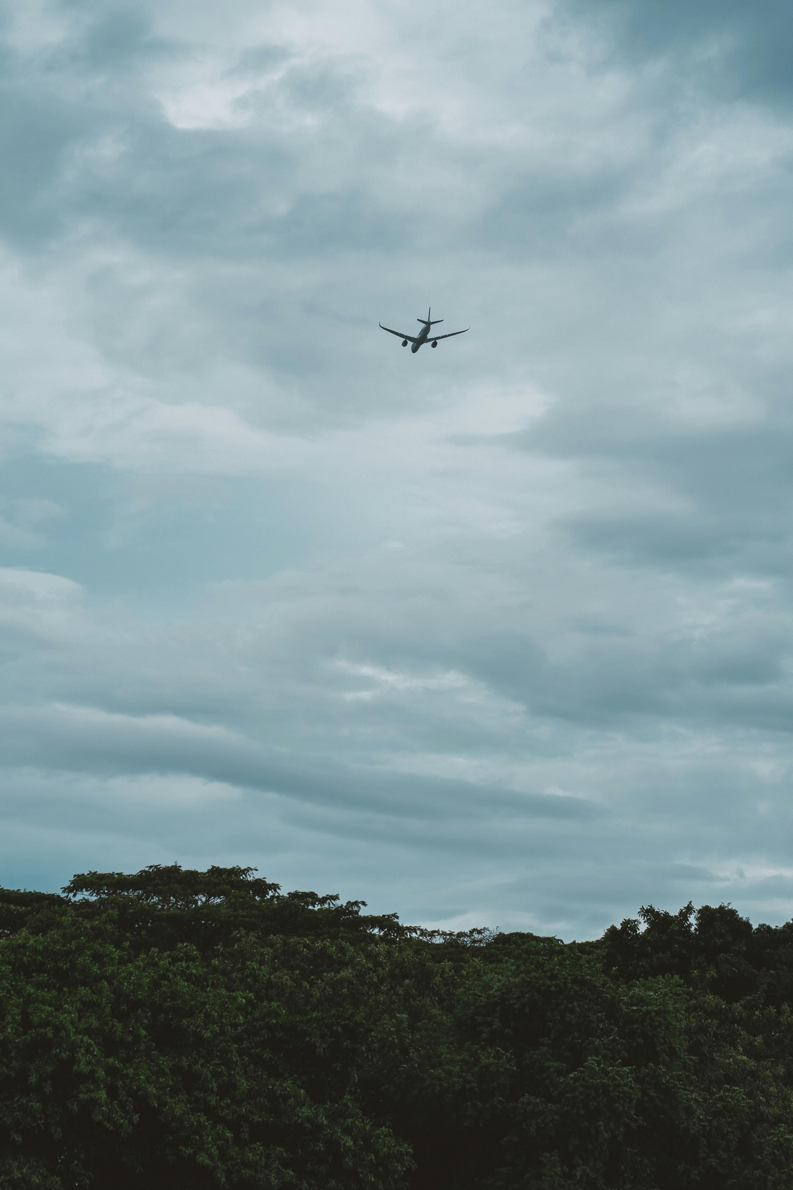 Military Jet under Cloudy Sky · Free Stock Photo