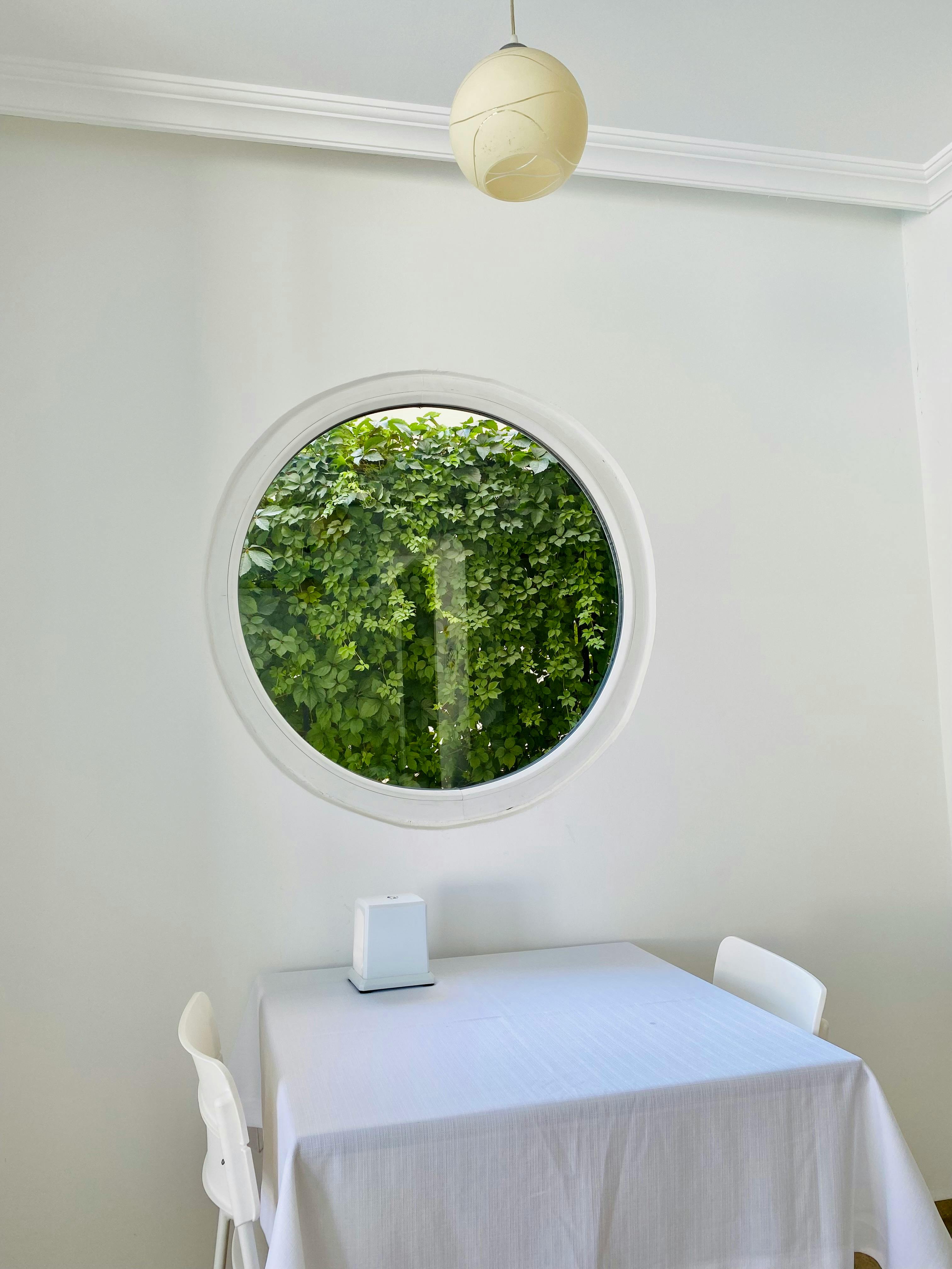 White Table under Circular Window · Free Stock Photo