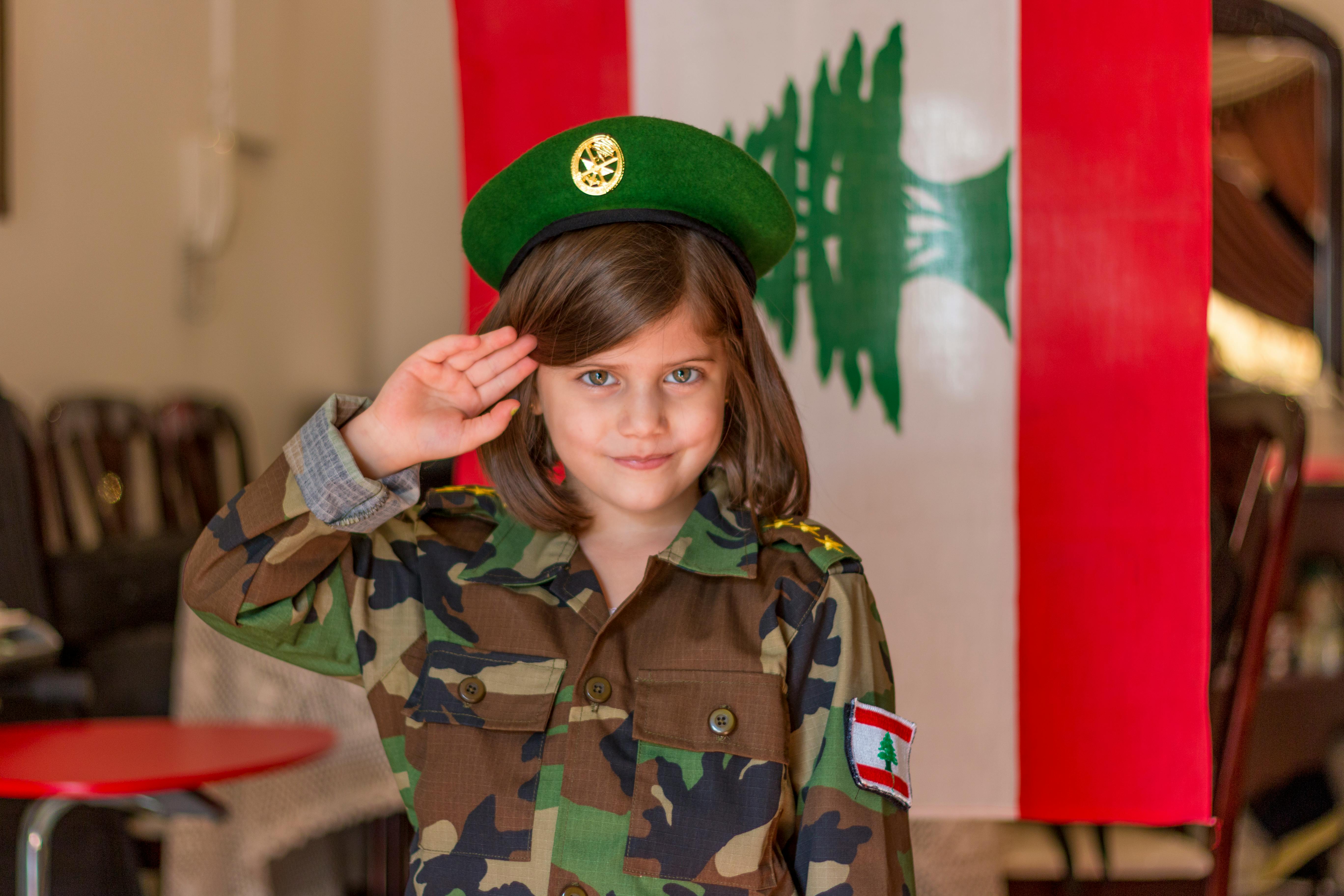 Boy in Scout Uniform Saluting · Free Stock Photo