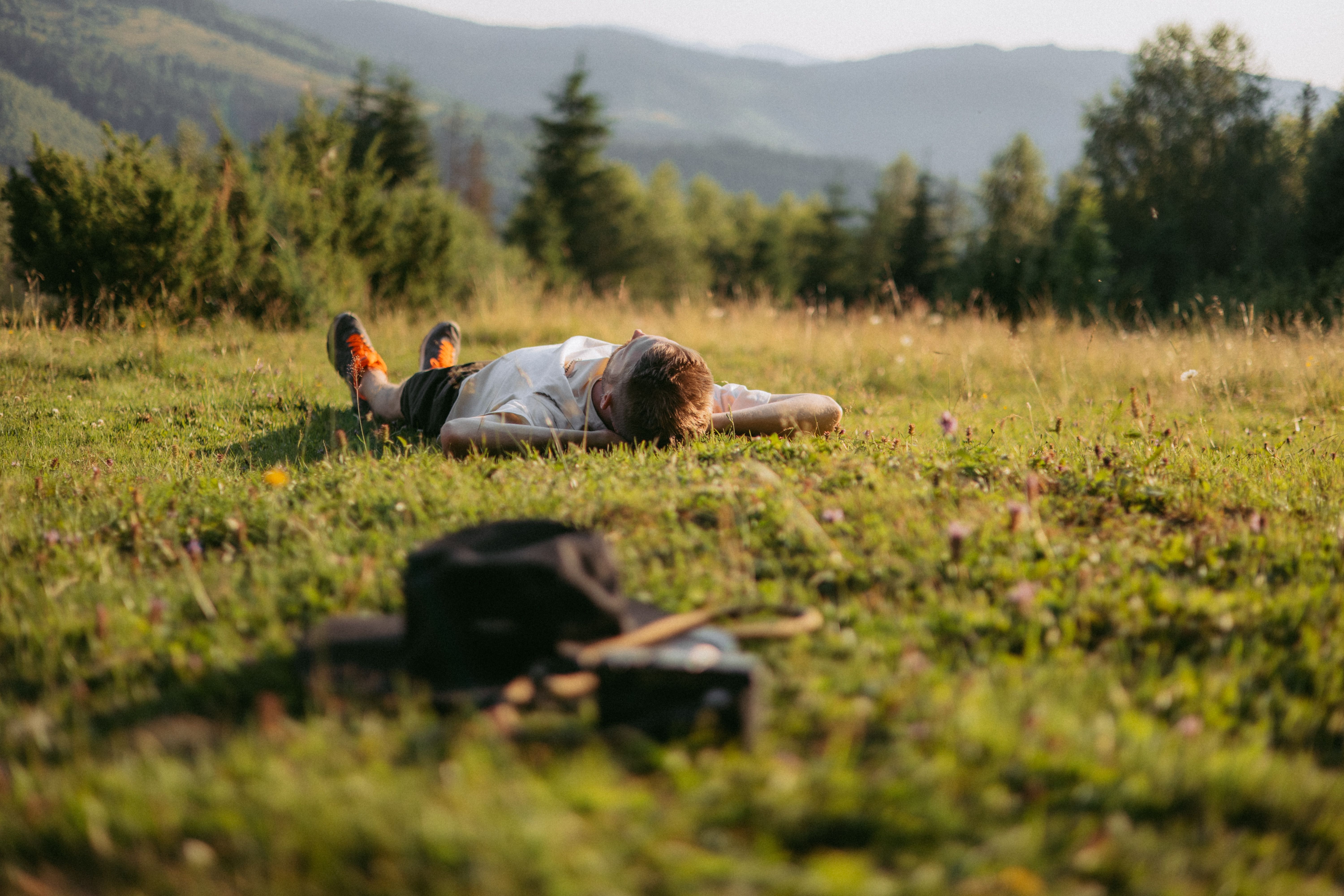 Man Lying Down on Grass and Relaxing · Free Stock Photo