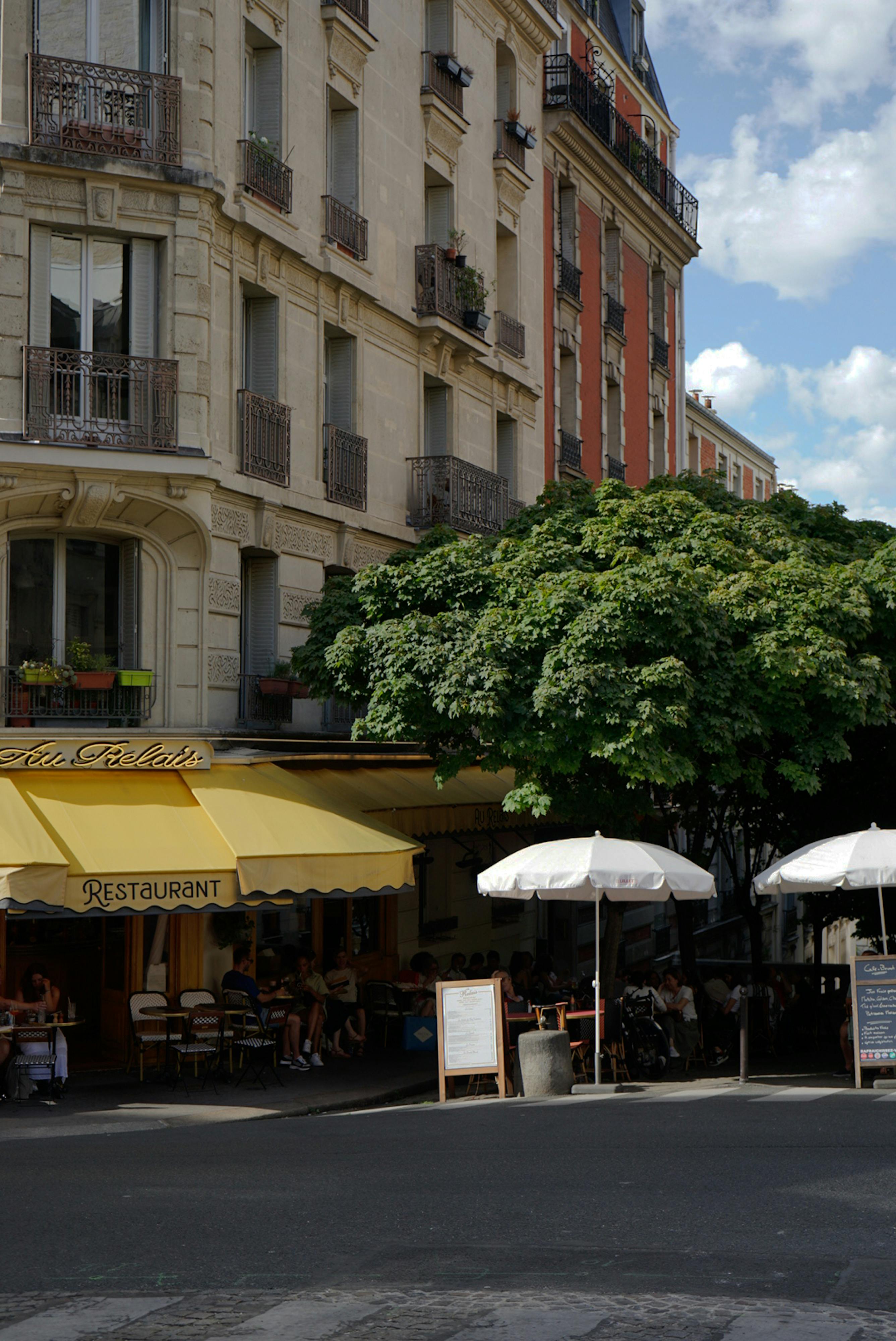 Customers at the Tables in Front of the Au Relais Restaurant in Paris ...