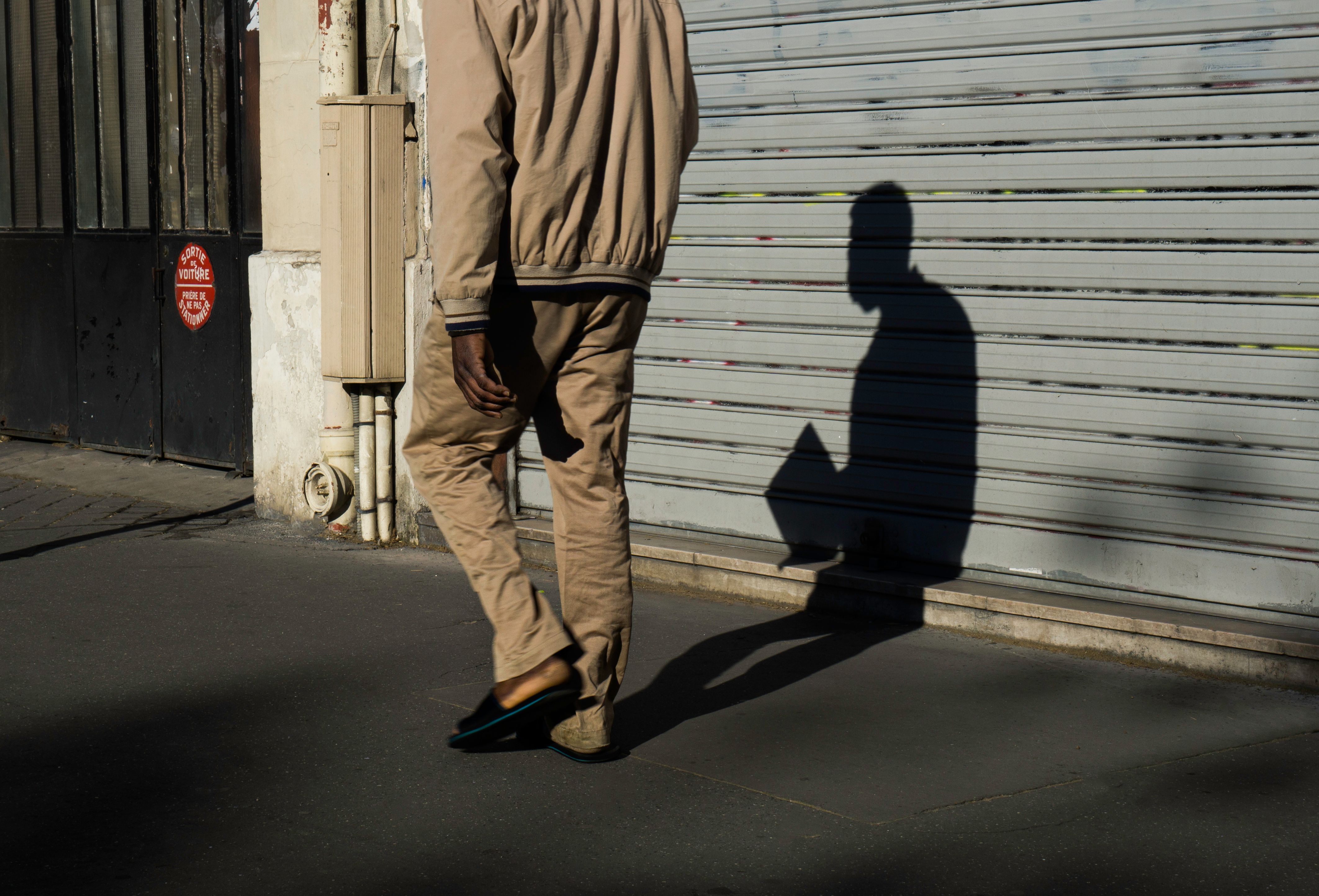 Man Walking on Pavement on City Street · Free Stock Photo