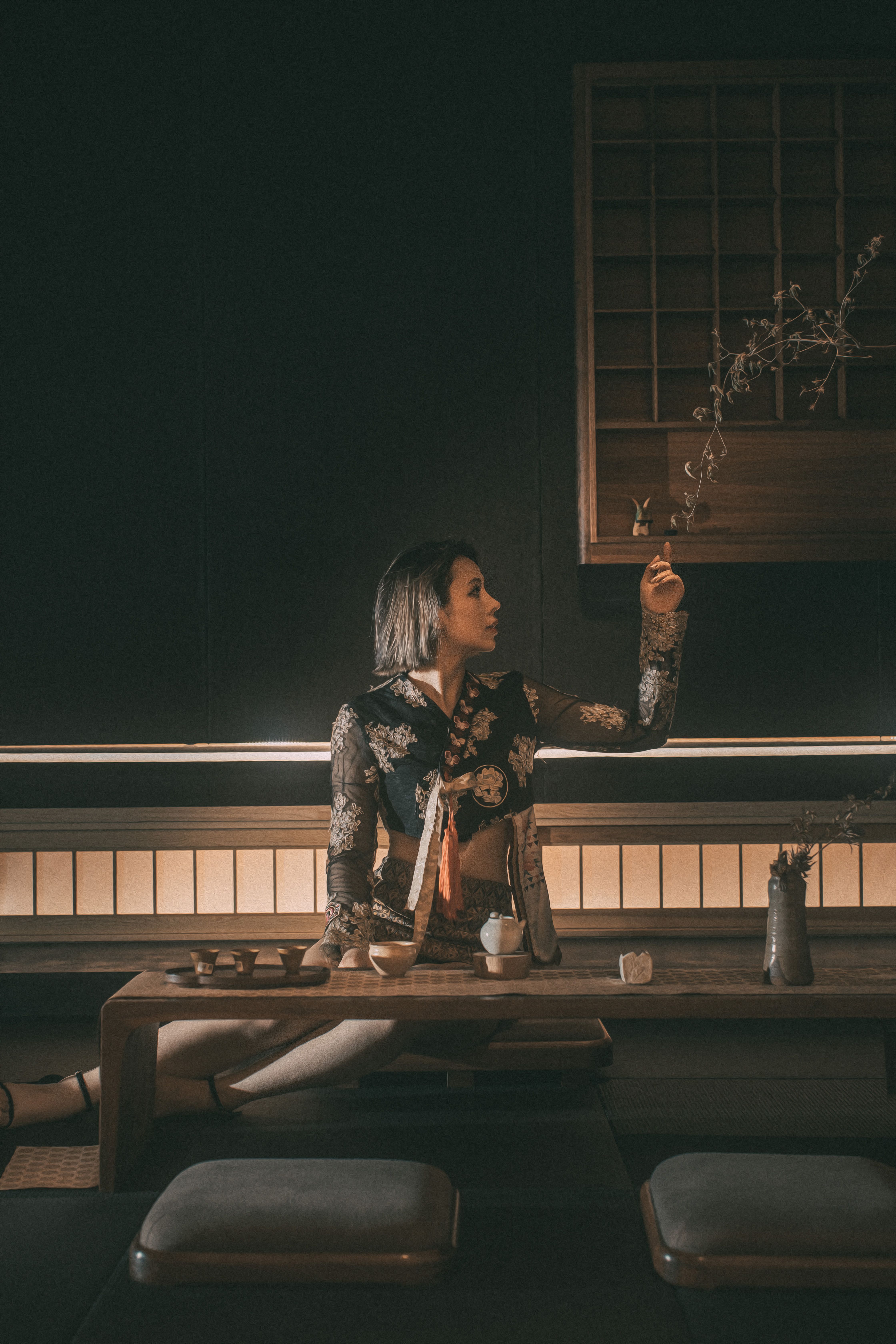 Woman Sitting at a Table in a Japanese Style Room · Free Stock Photo