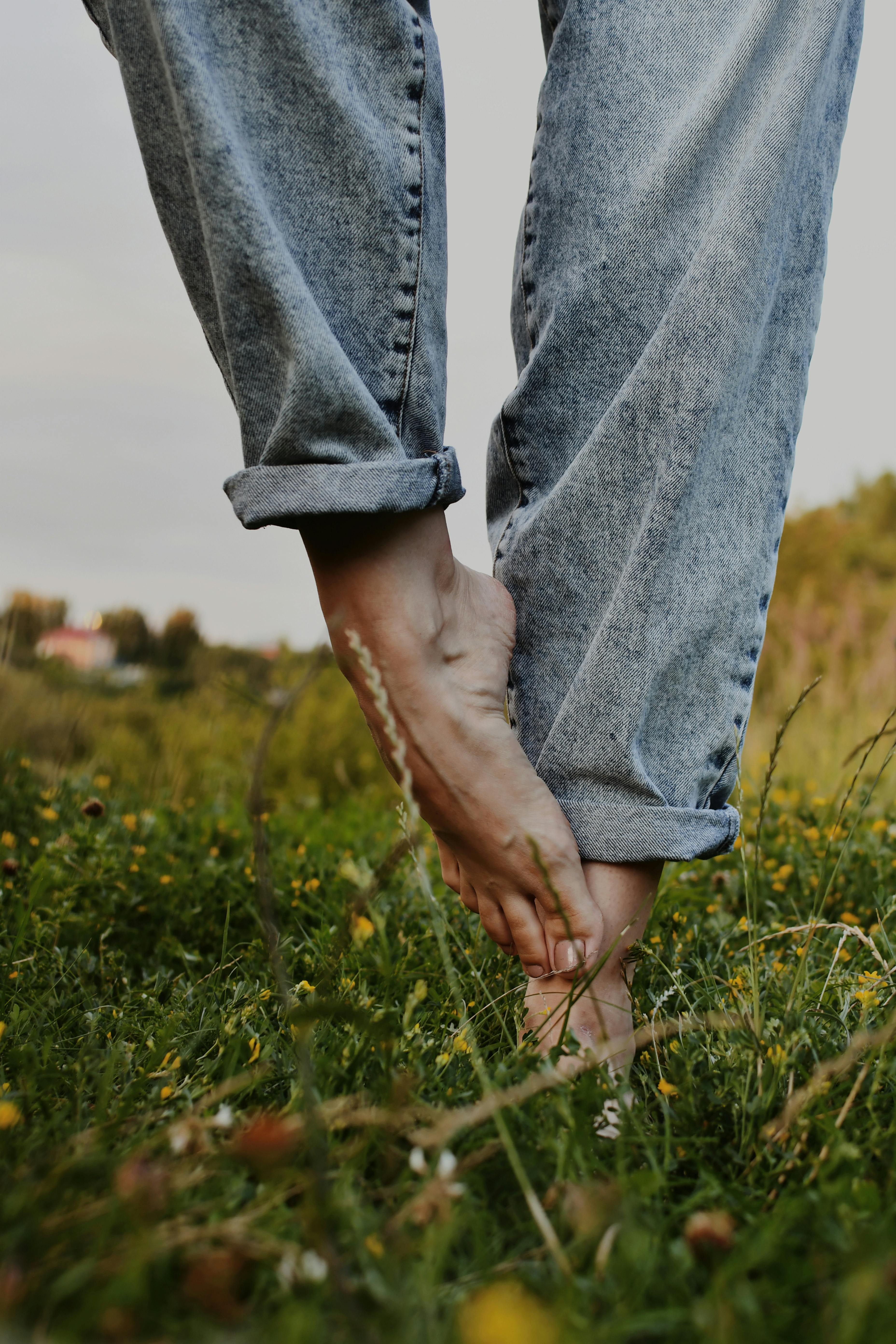 Legs of Barefoot Person in Yoga Pose · Free Stock Photo
