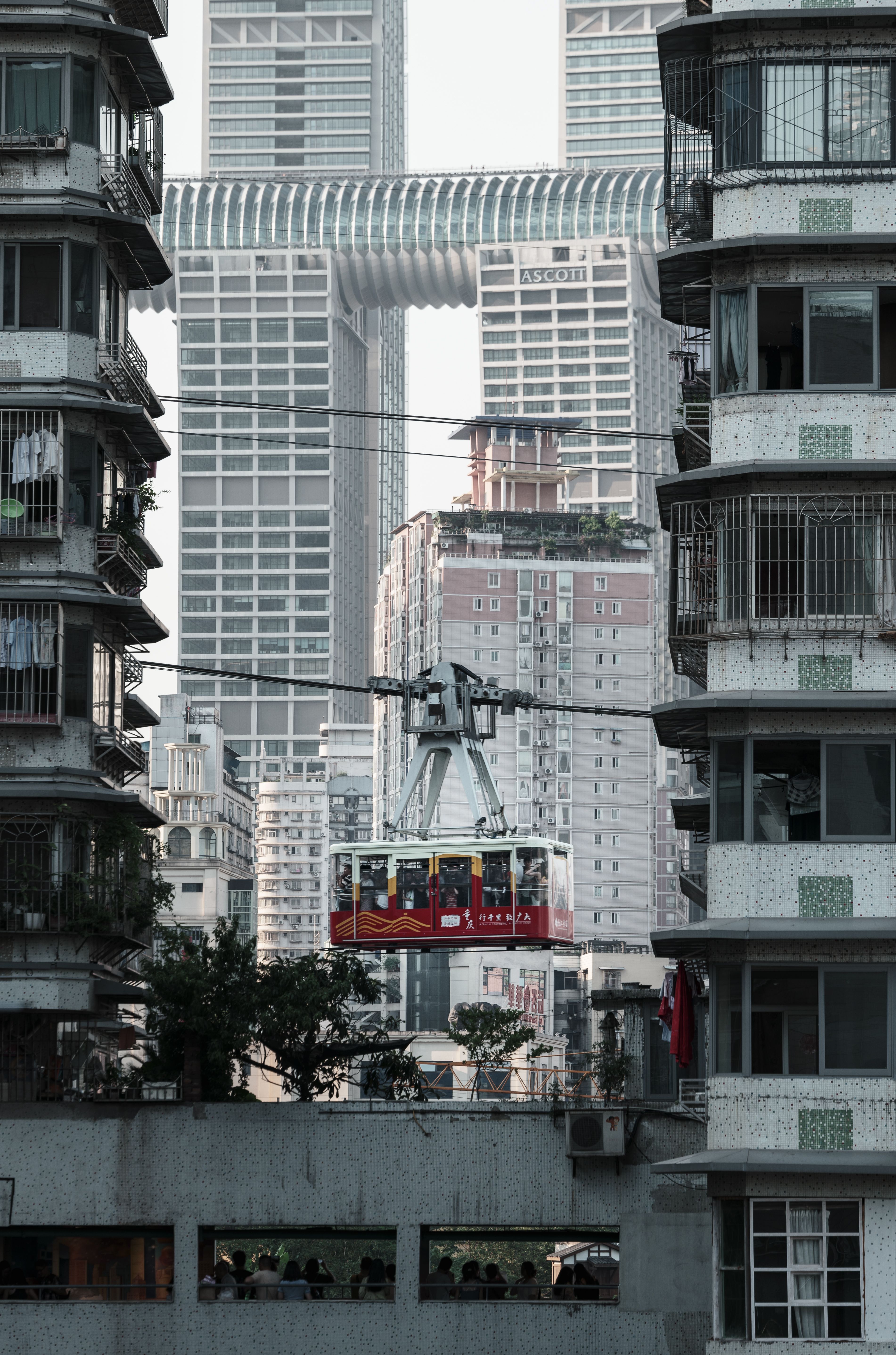 Cable Car between Buildings in City · Free Stock Photo
