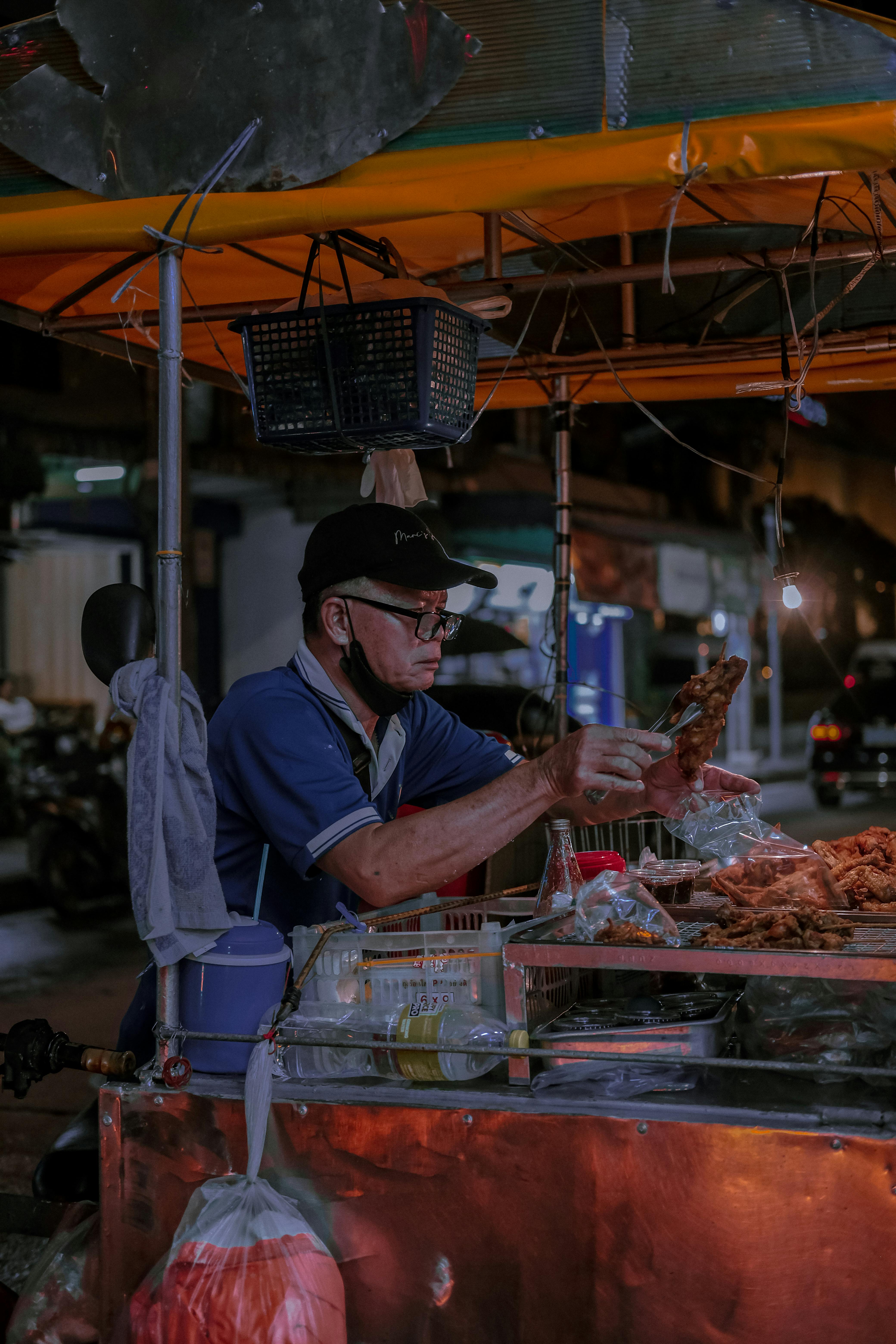 Man Selling Food on a Market · Free Stock Photo