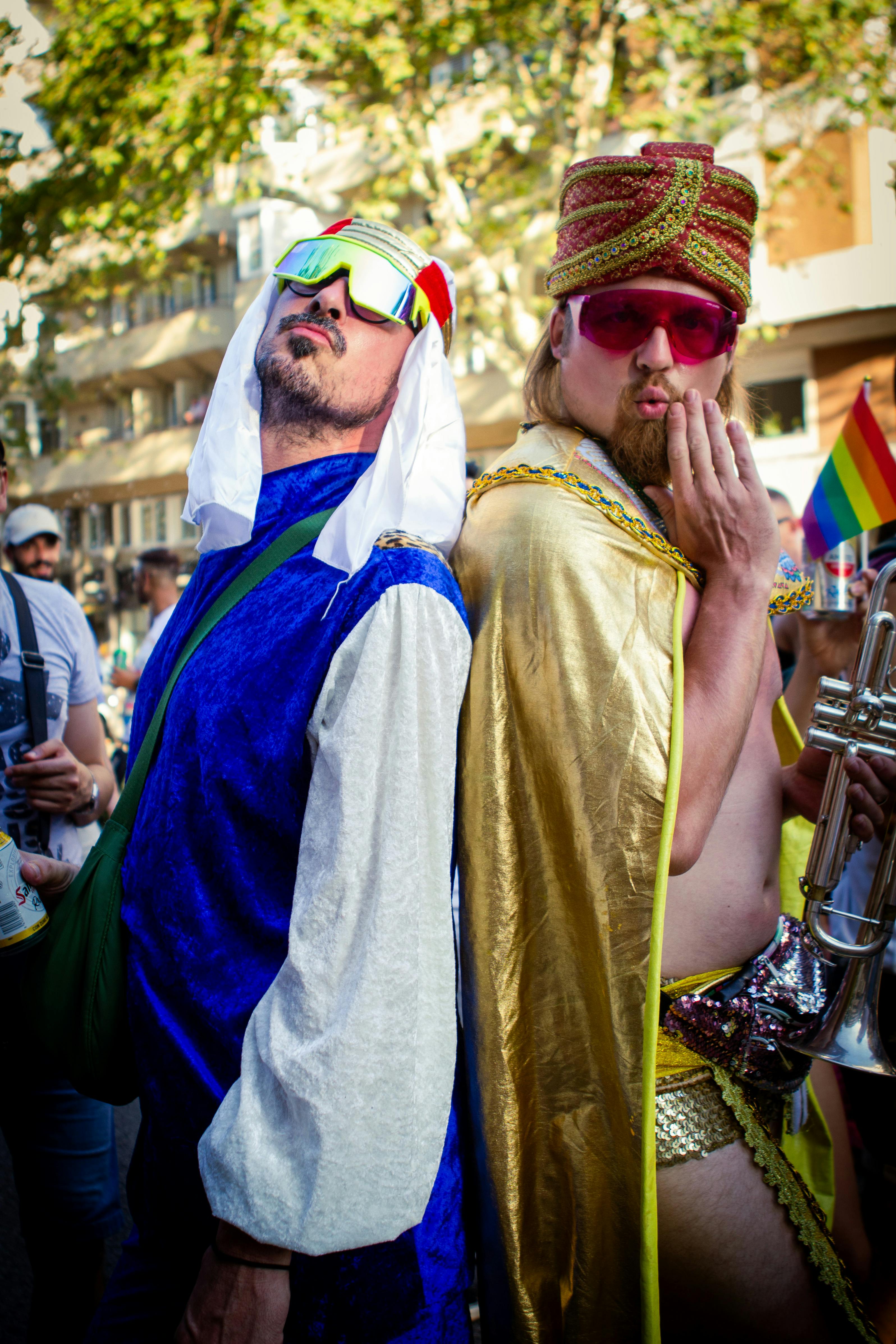 Photo of Two Men in Costumes at a Pride Parade in City · Free Stock Photo