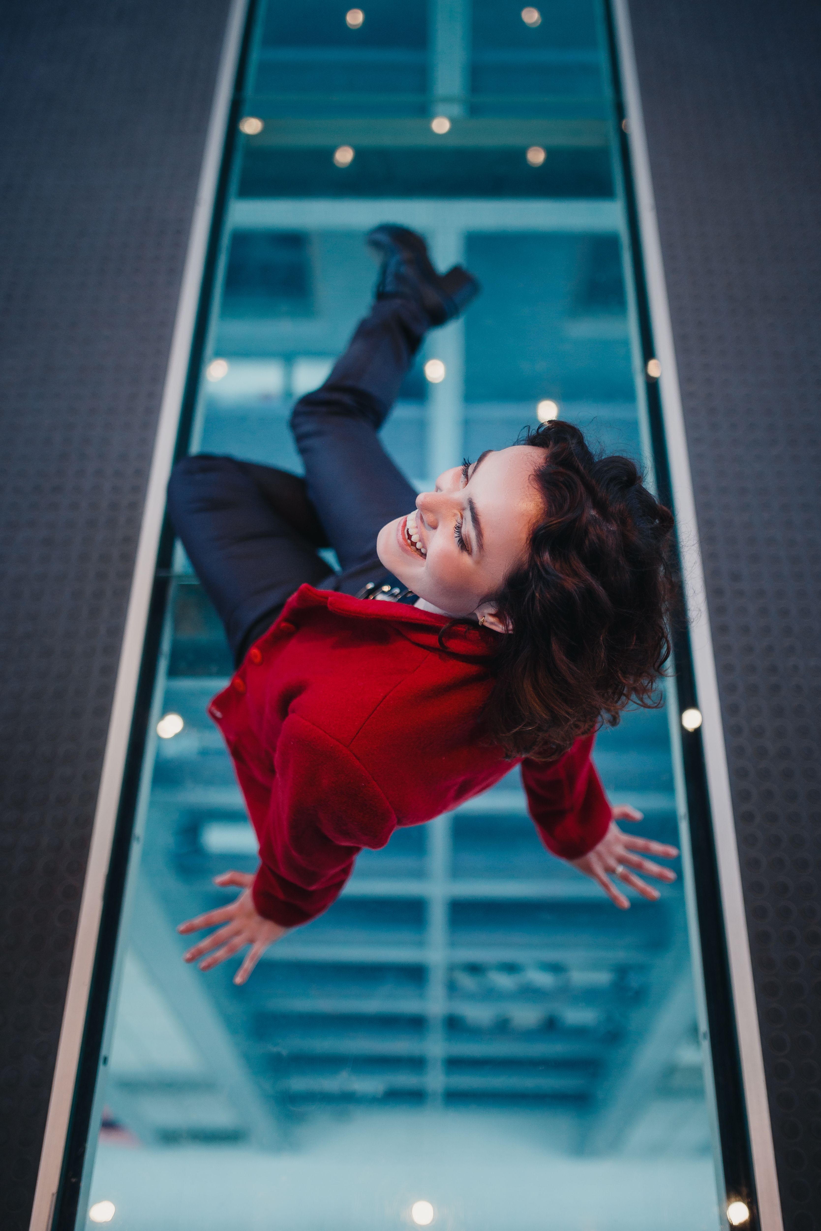 A Woman Sitting on Glass · Free Stock Photo