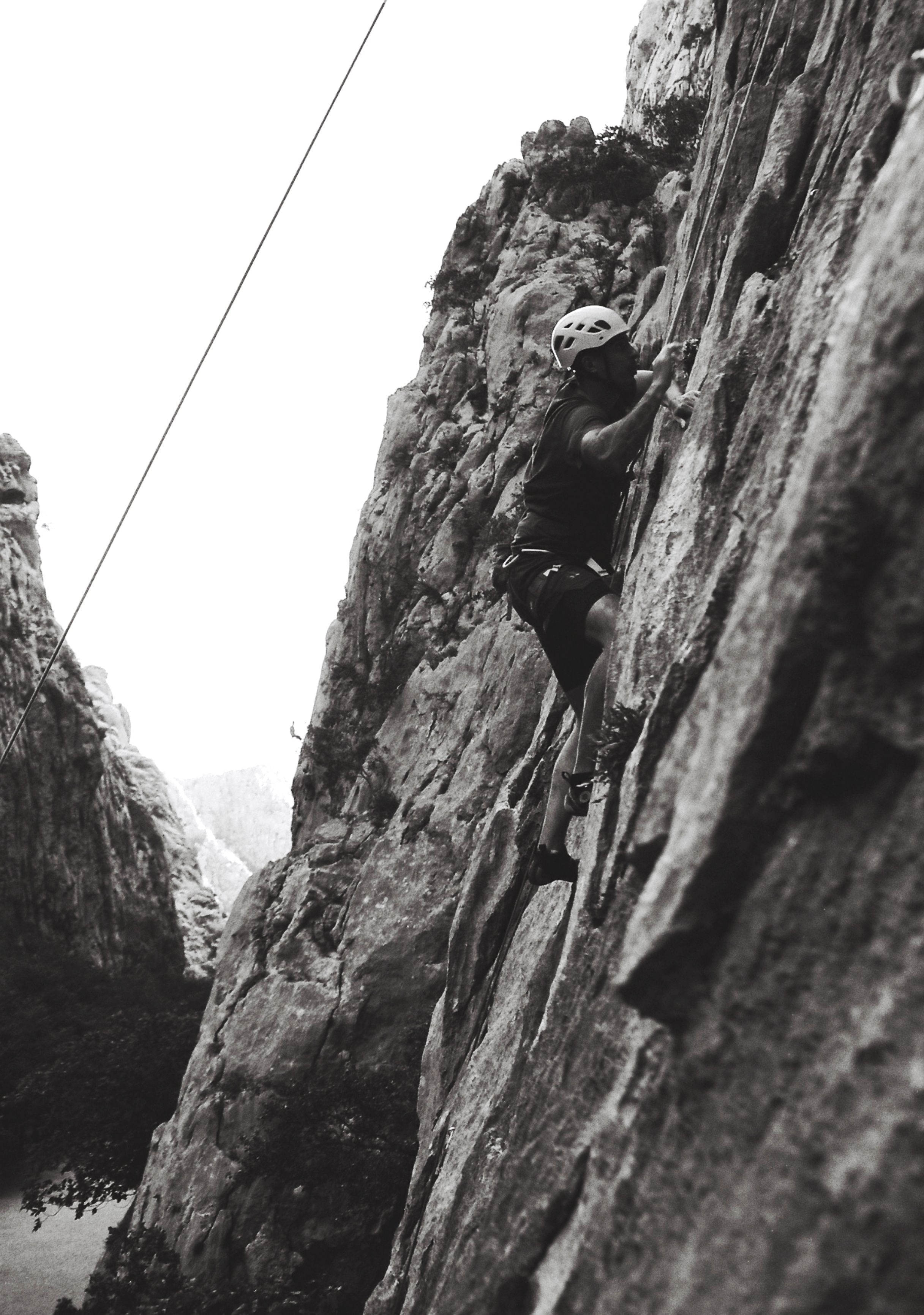 Man Climbing on Horizontal Rock · Free Stock Photo