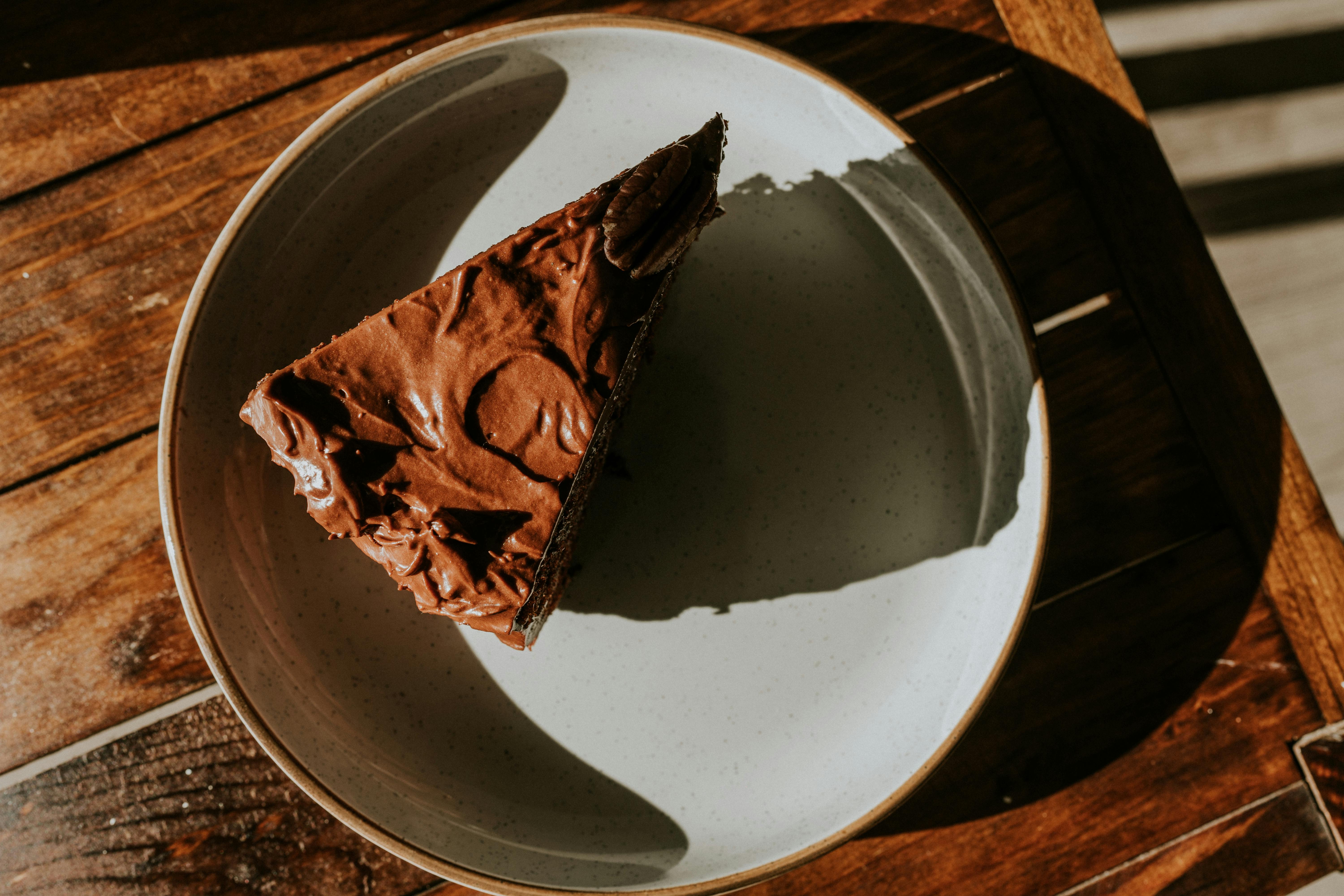 Selective Focus Photo of Sliced Cake on Table · Free Stock Photo