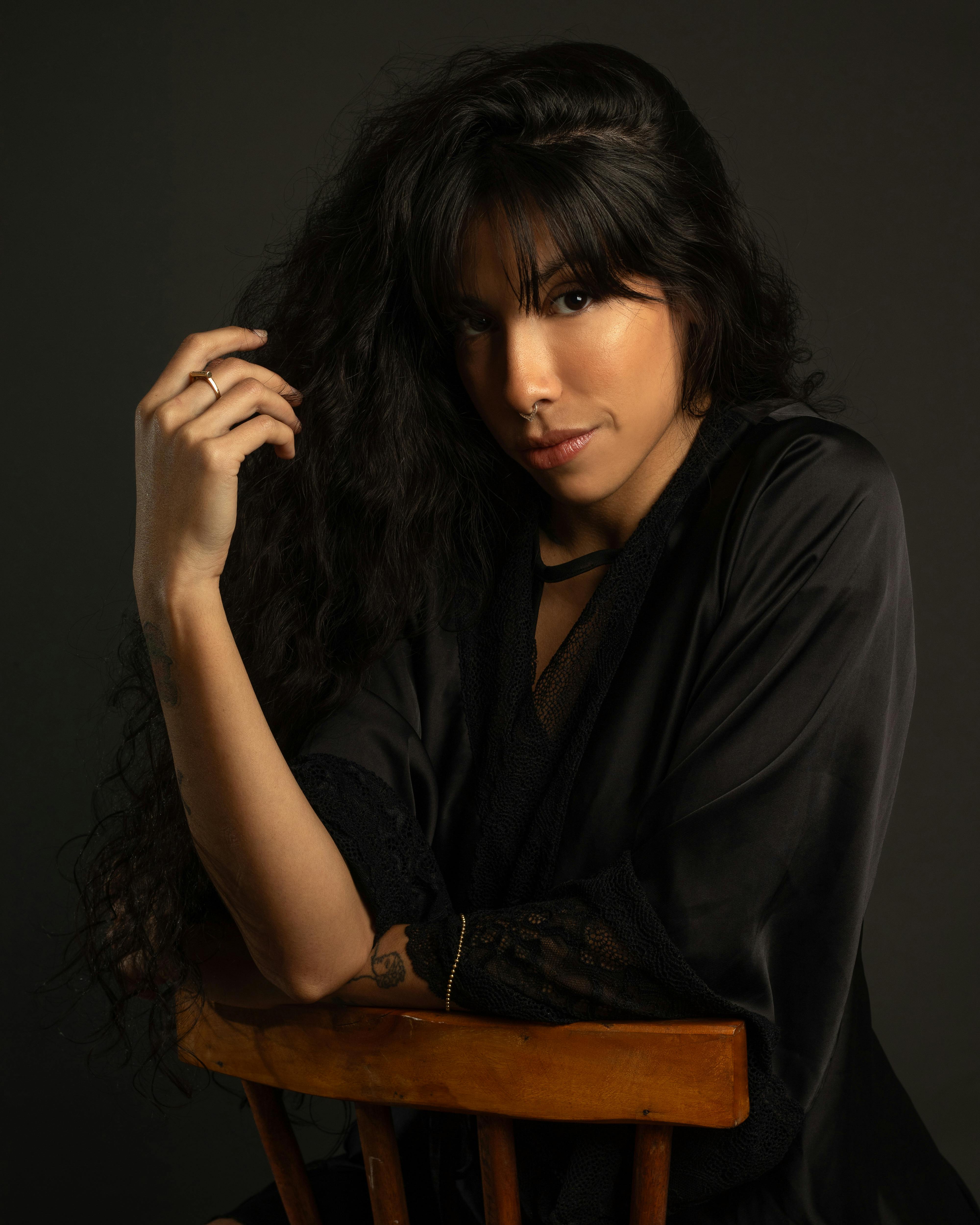 Brunette Woman Sitting Backwards · Free Stock Photo