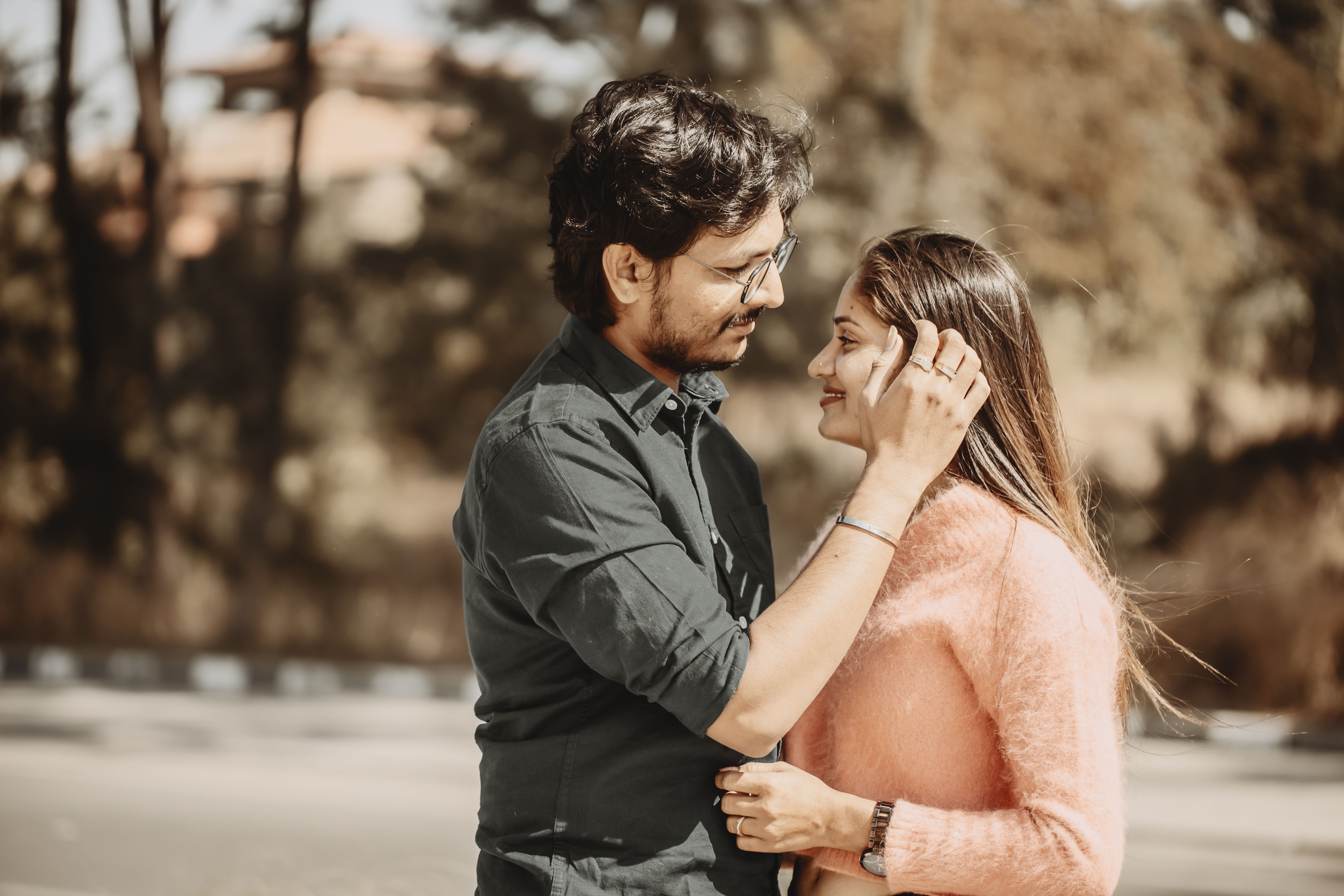 Young Couple Standing Face to Face and Embracing · Free Stock Photo