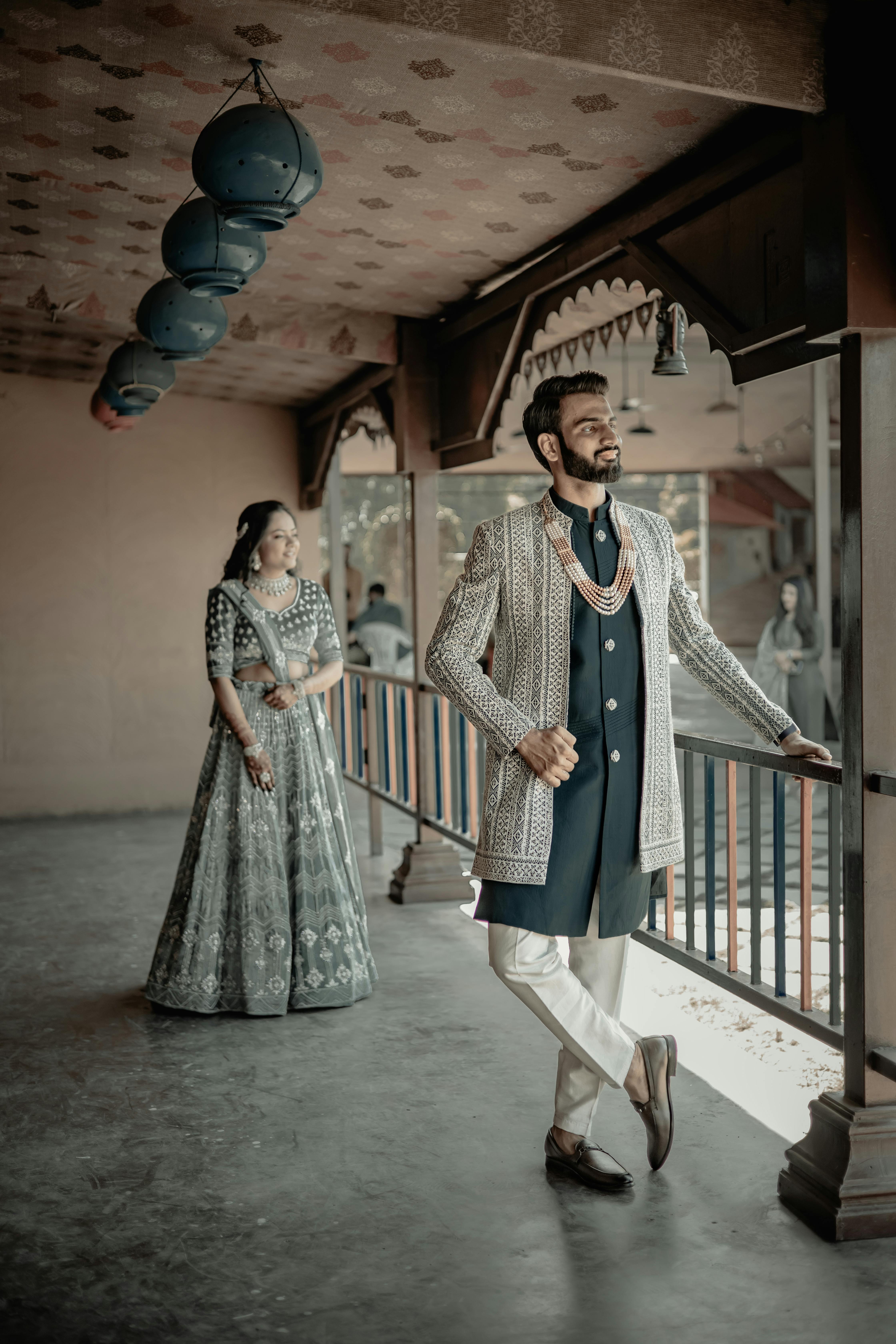 Two People Wearing Traditional Clothes · Free Stock Photo