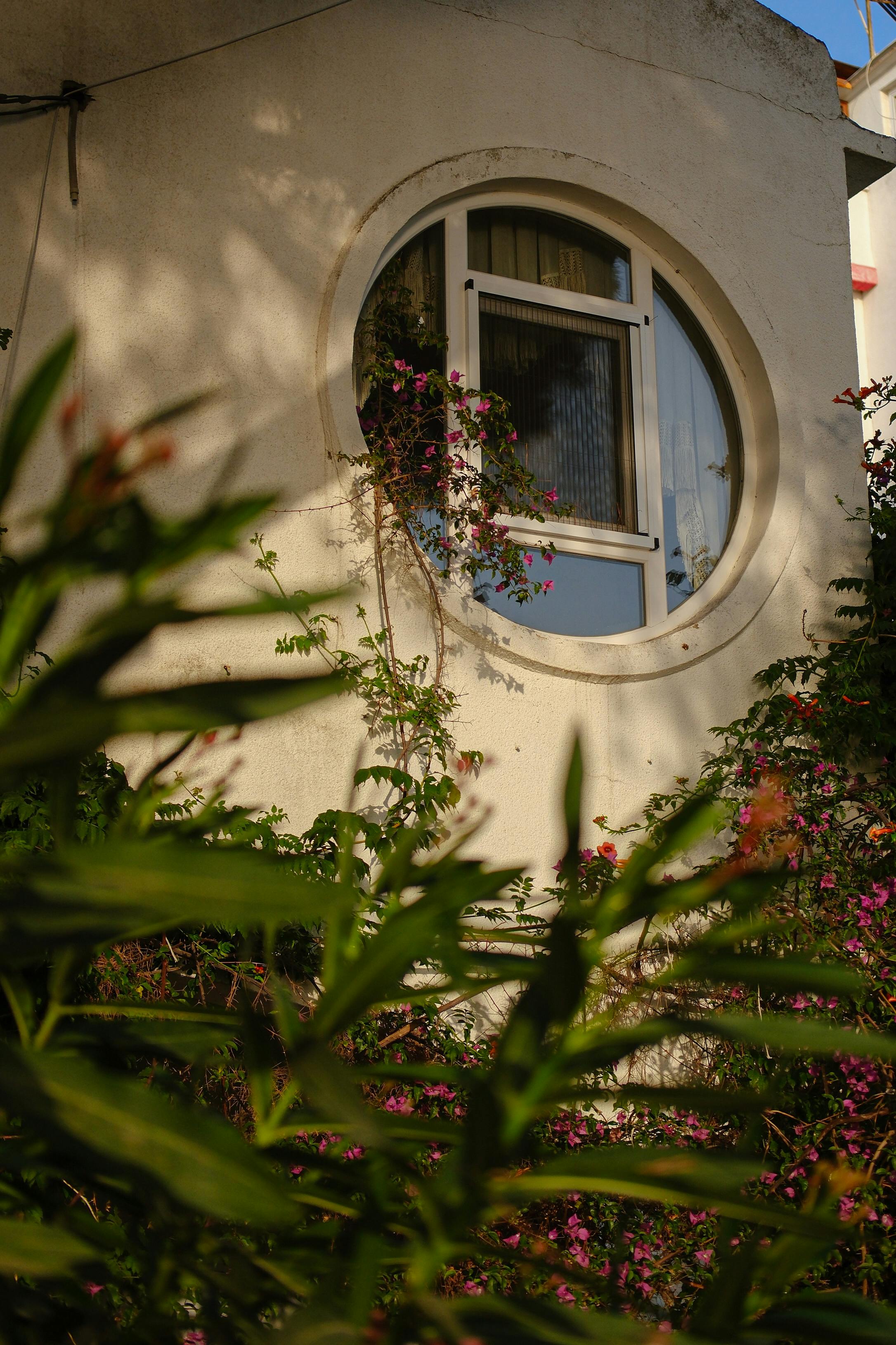 House Exterior with a Round Window · Free Stock Photo
