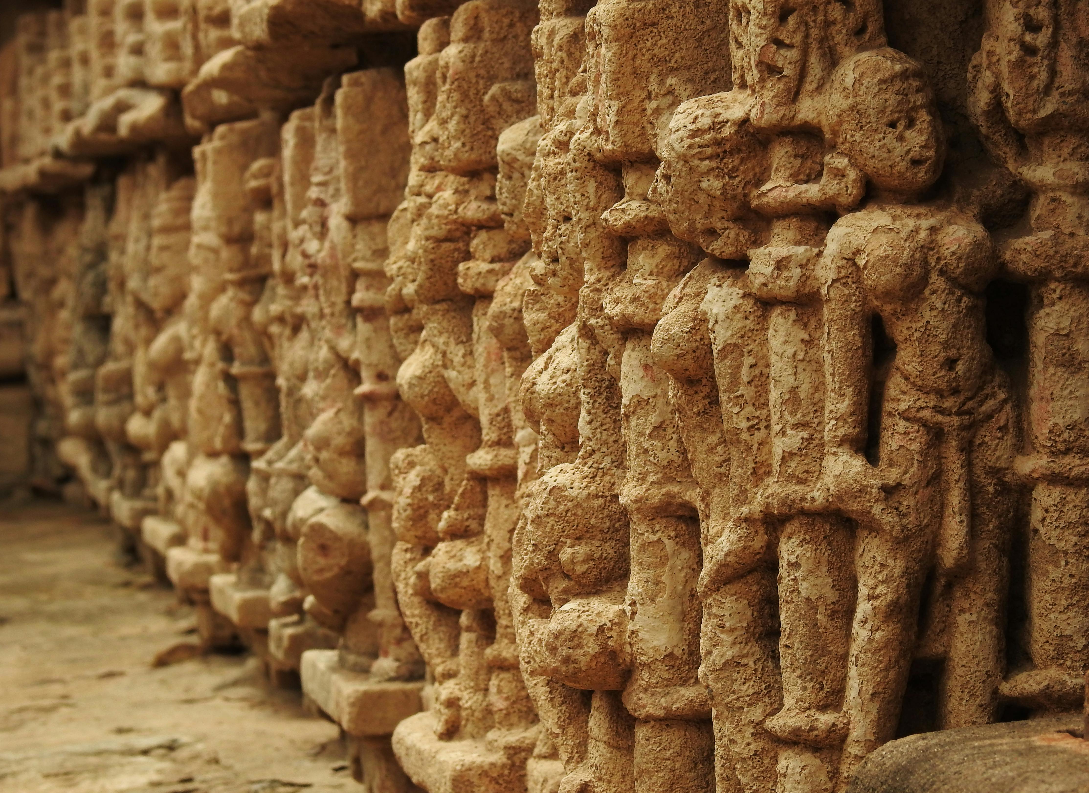 Row of Ancient, Stone Sculptures on Wall · Free Stock Photo