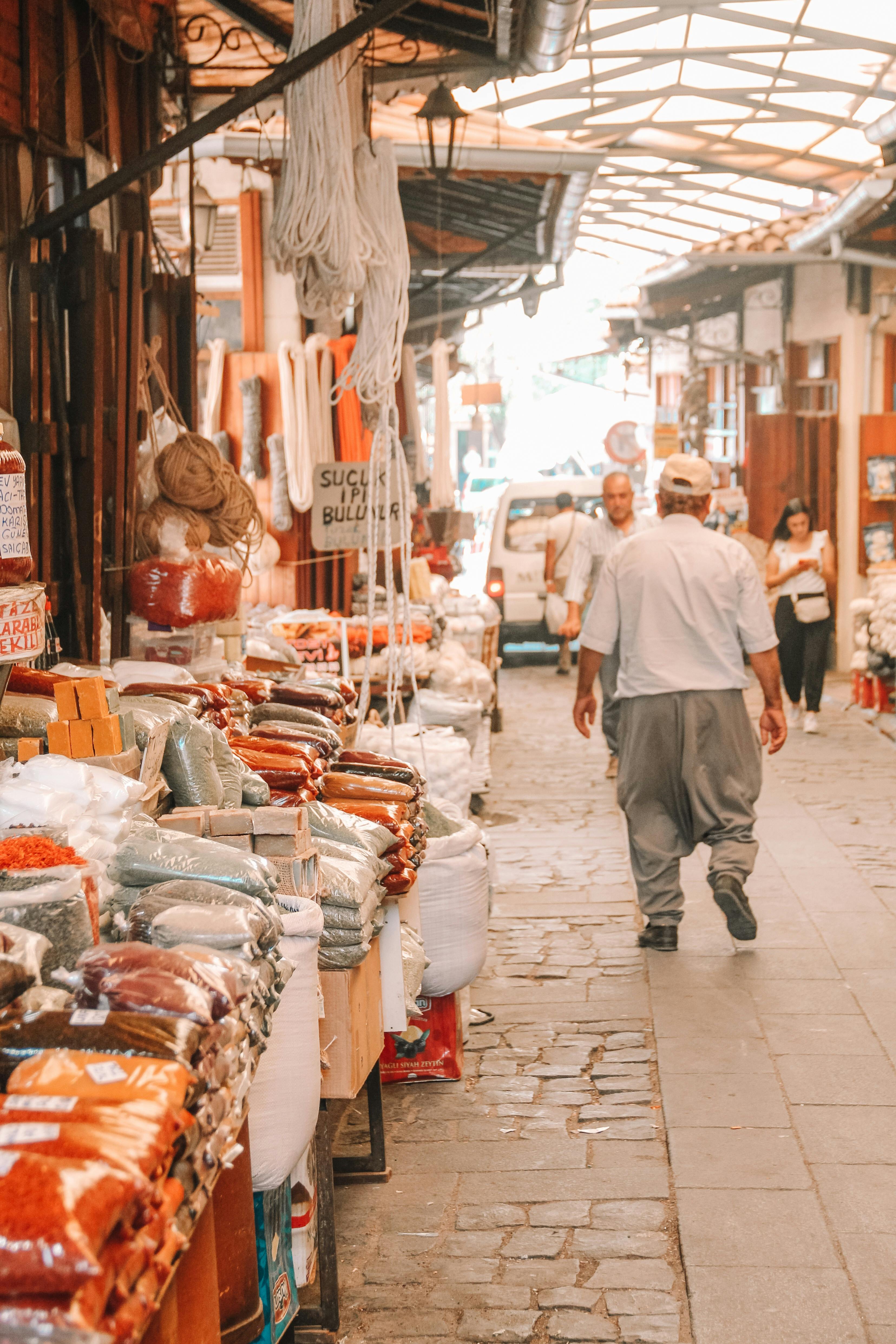 Stalls with Products Along Alley at Market · Free Stock Photo