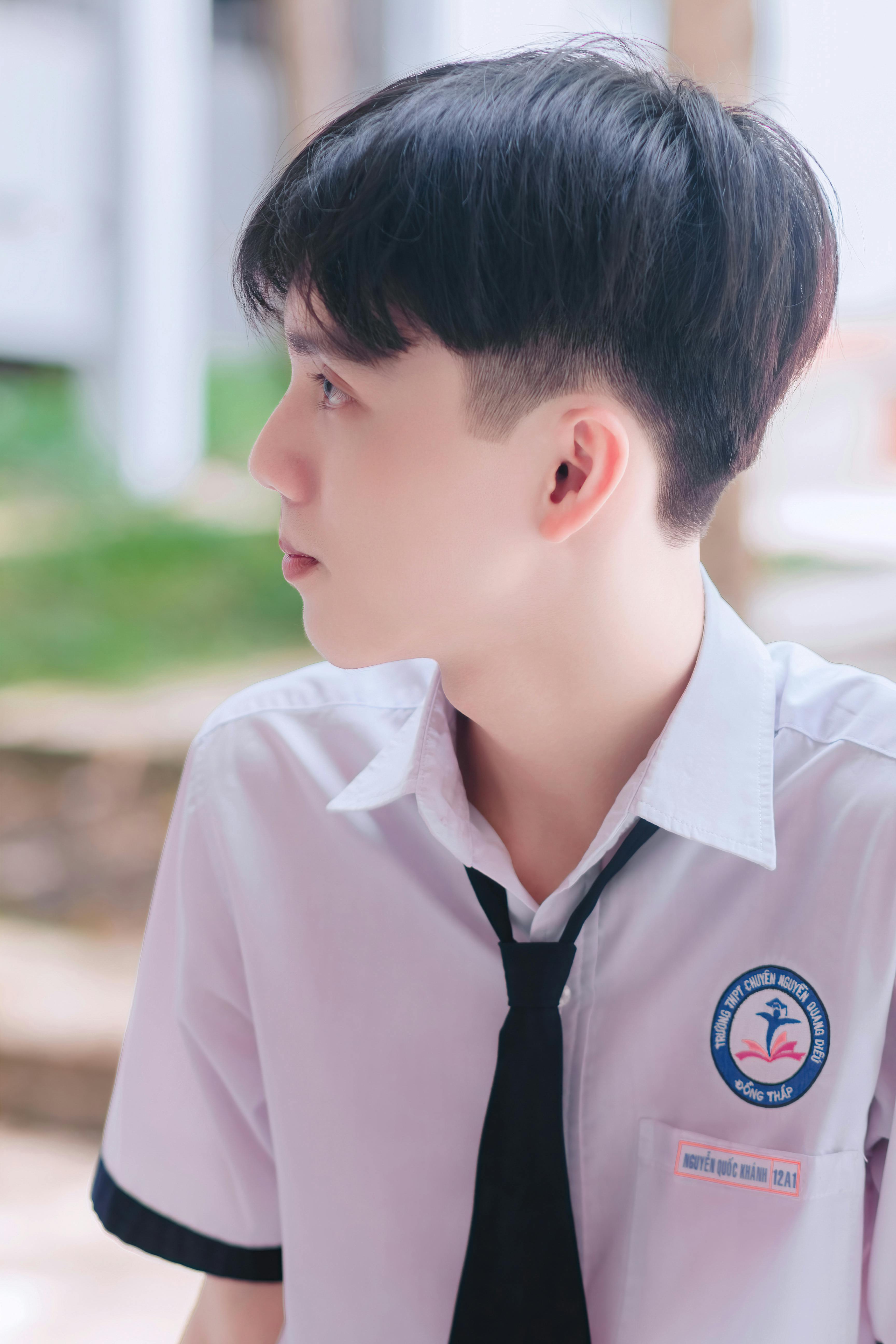 Young Woman with Short Hair Wearing School Uniform with Blue Sweater ...