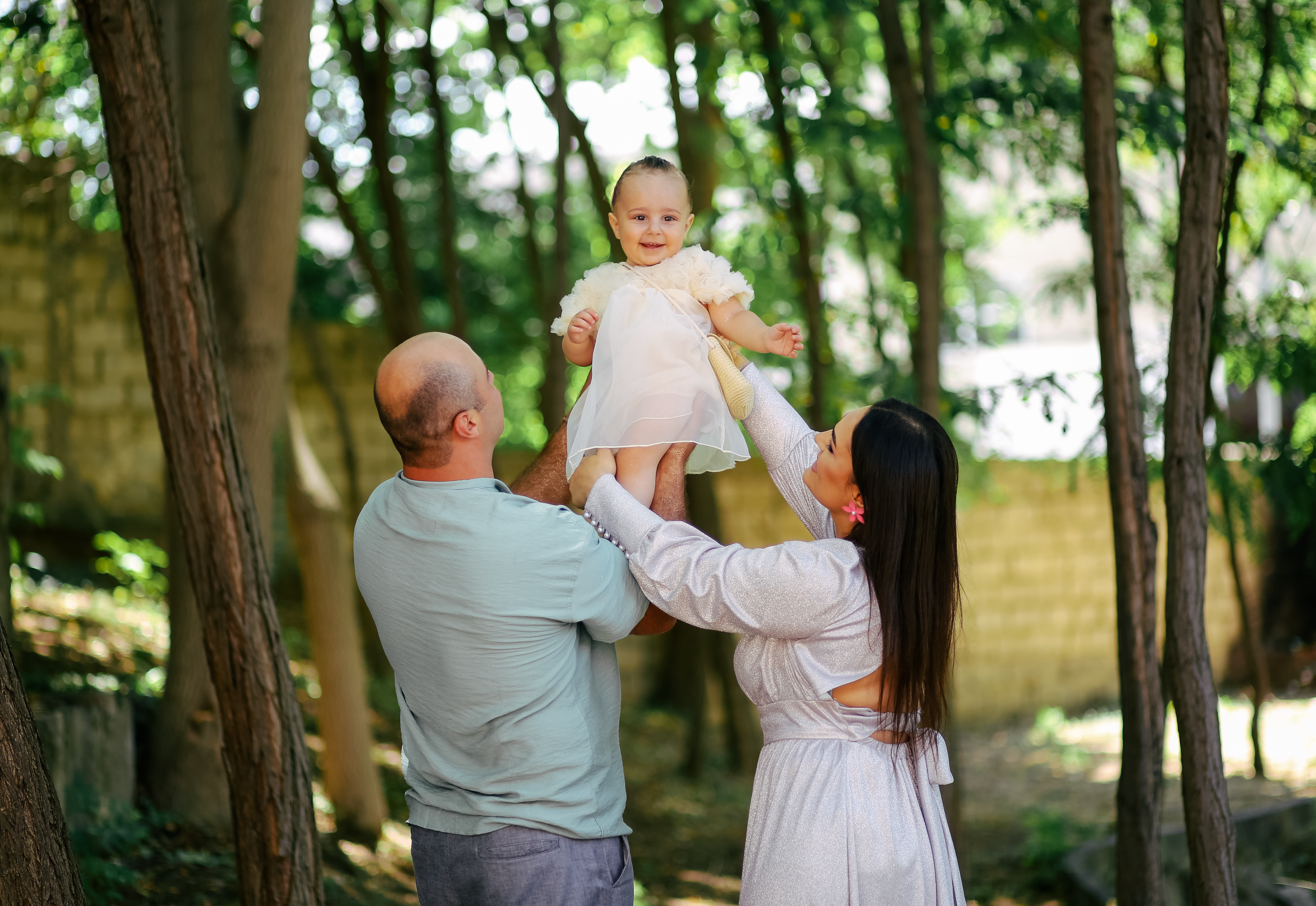 Parents Holding their Child · Free Stock Photo