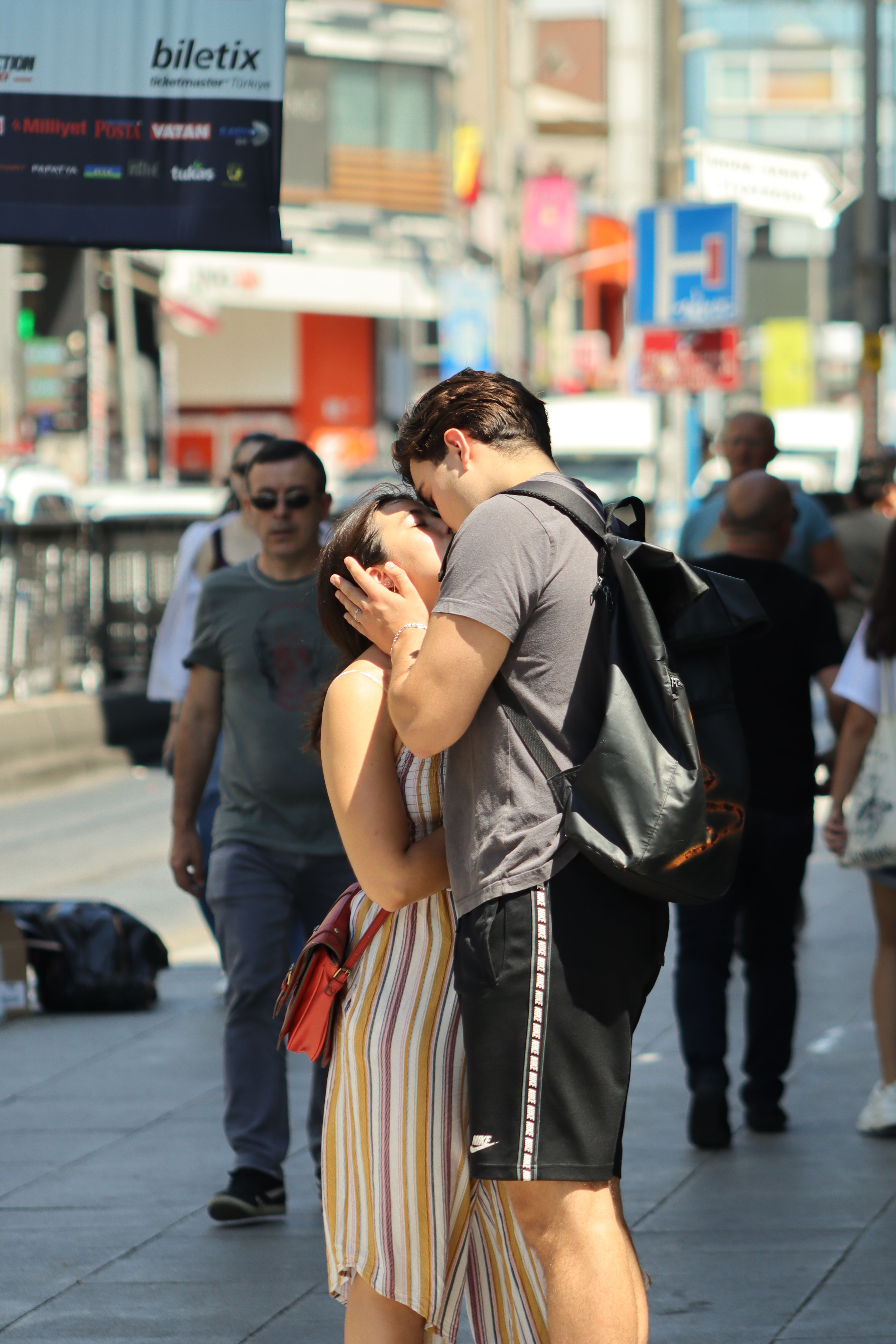 A Couple Kissing on the Sidewalk in City · Free Stock Photo