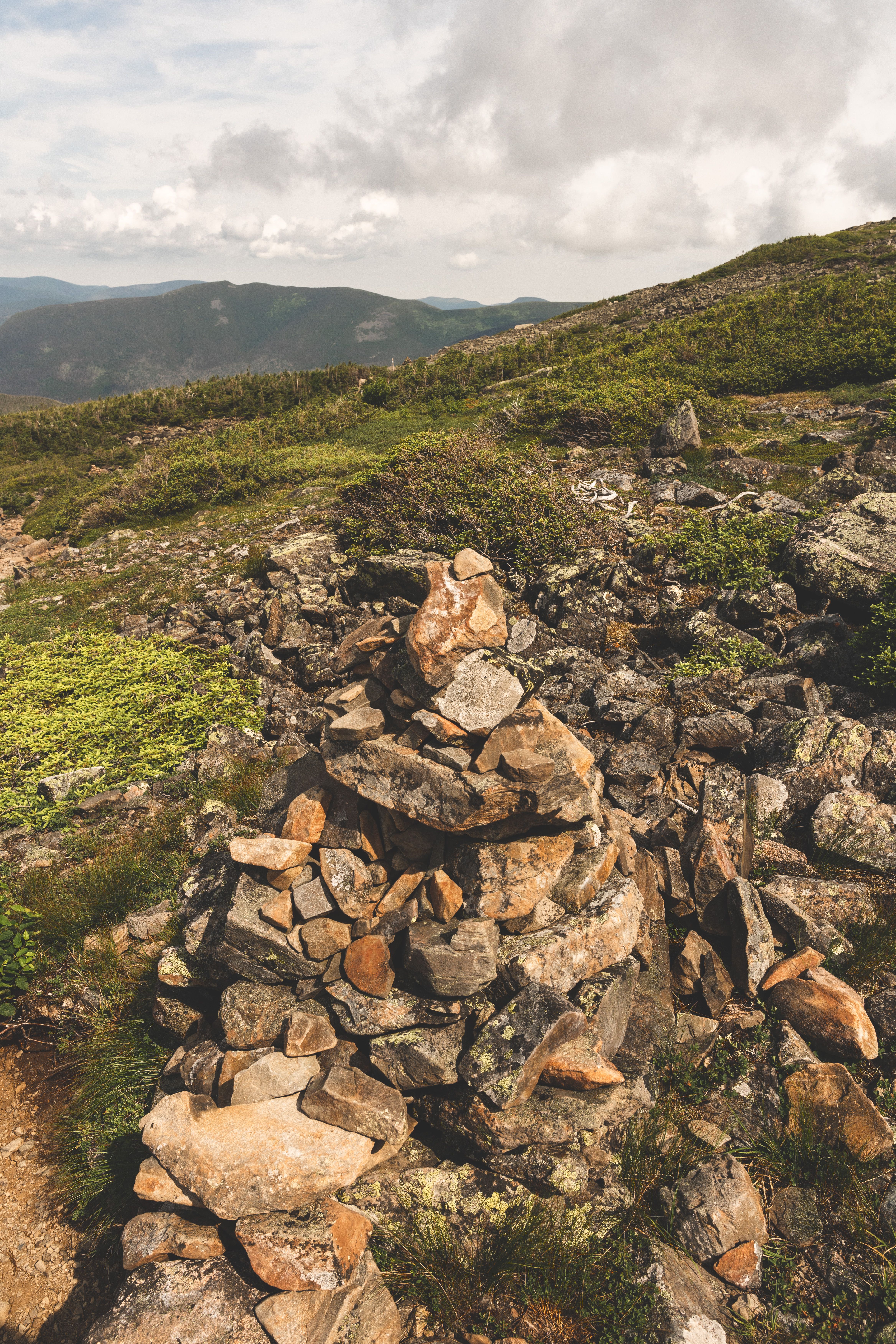 A pile of rocks on top of a mountain · Free Stock Photo