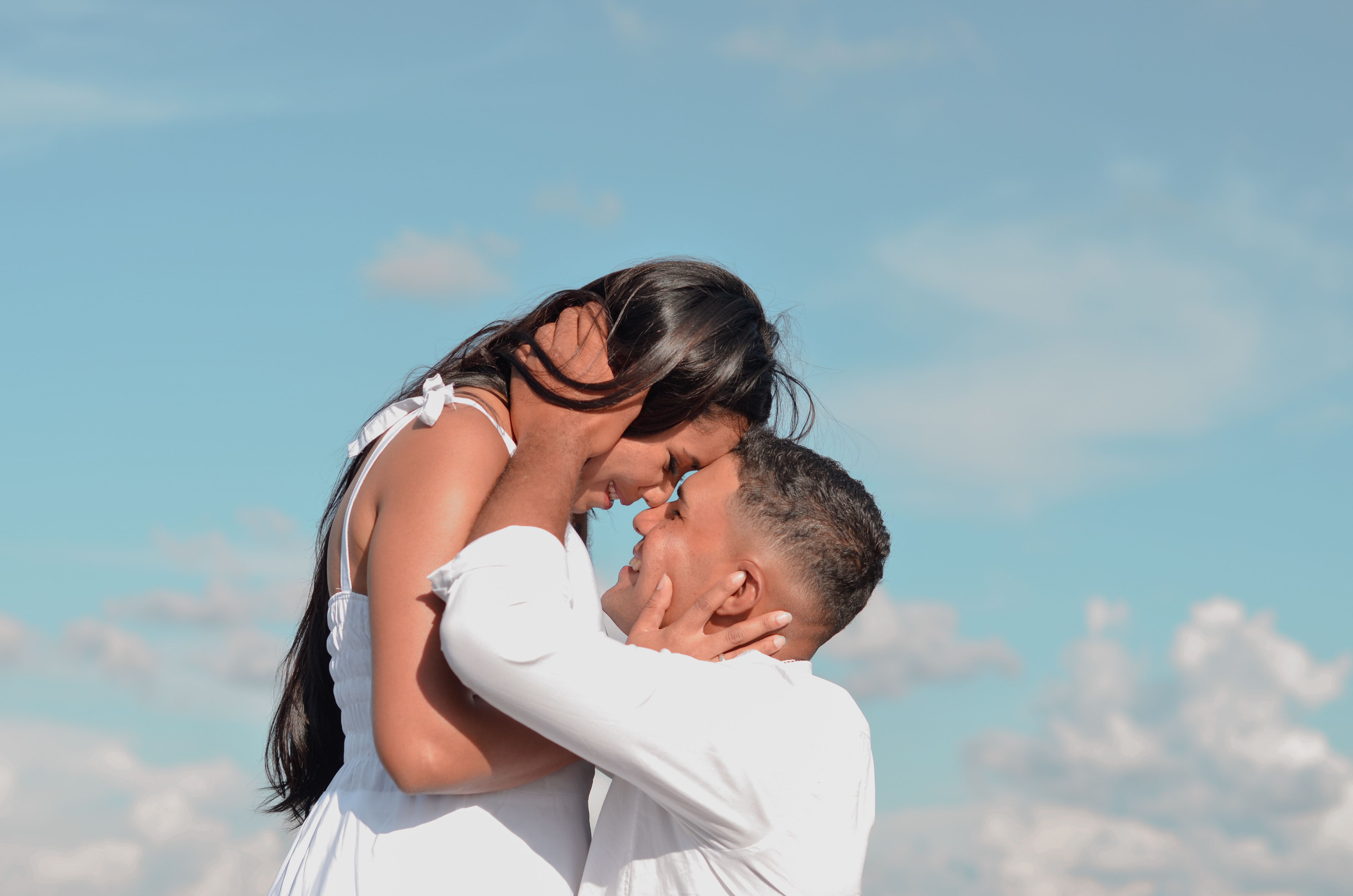 Couple Hugging by Building · Free Stock Photo