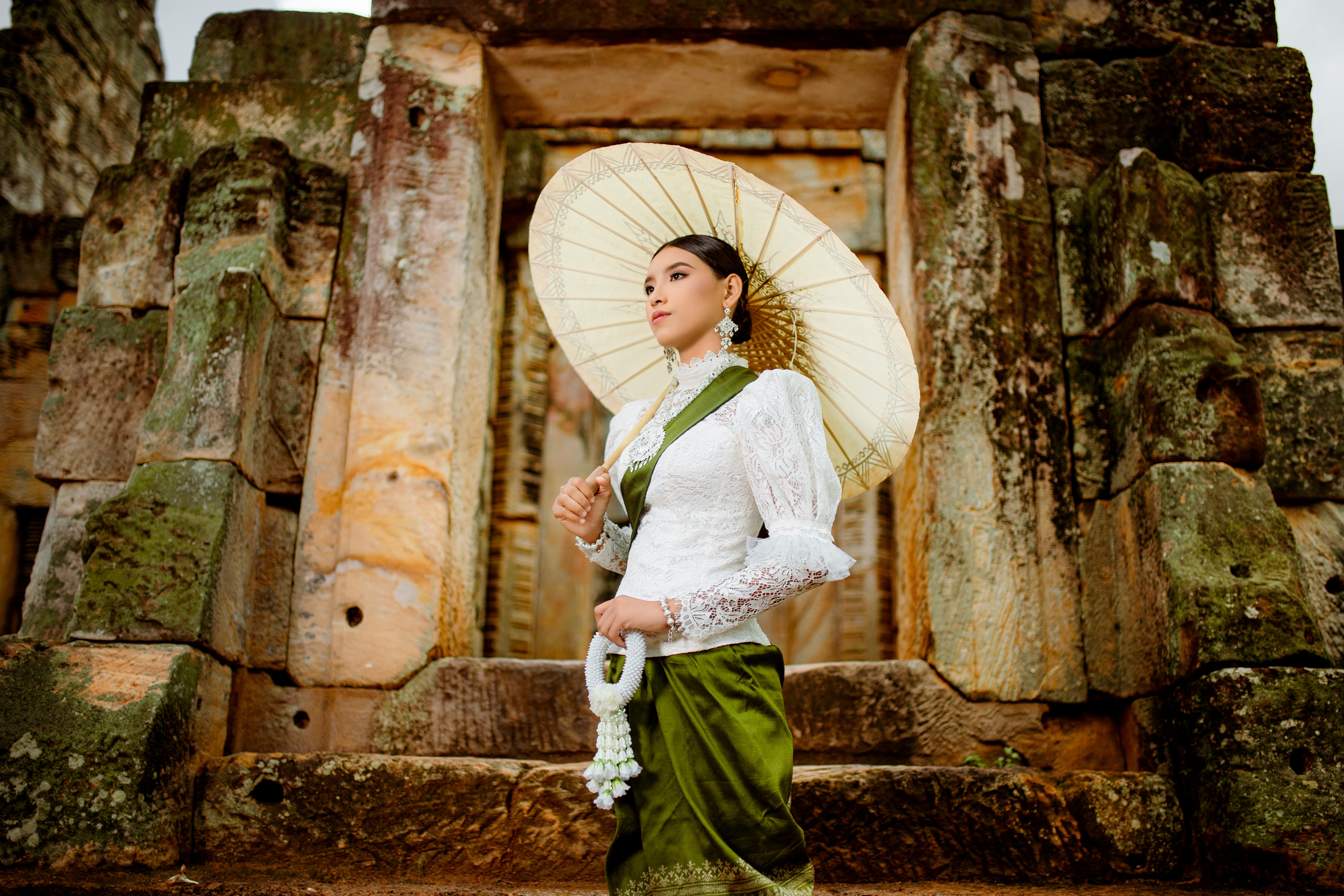 Woman in Traditional Clothing and with Umbrella · Free Stock Photo