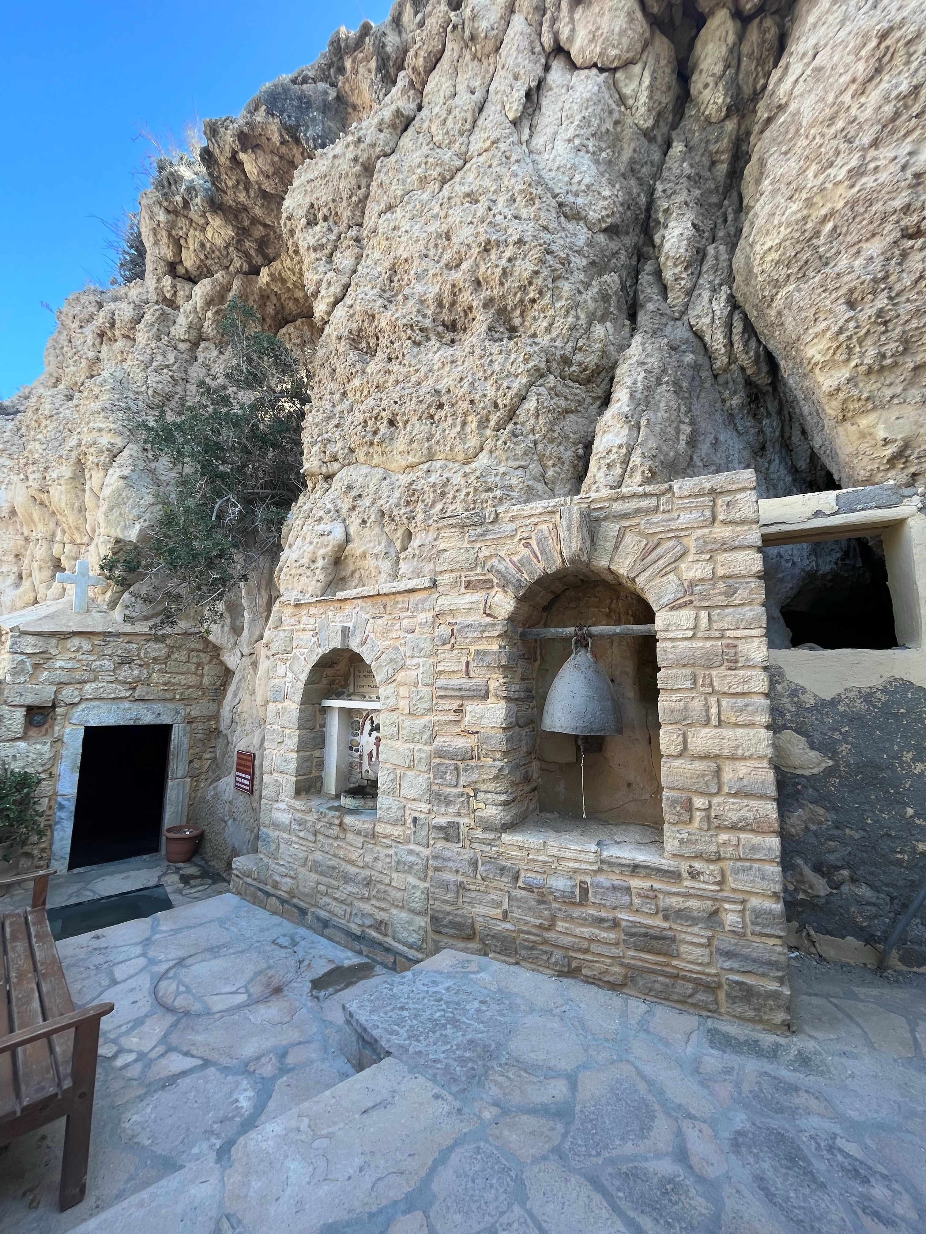 A Bell at the Monastery Carved in the Stone Hill · Free Stock Photo