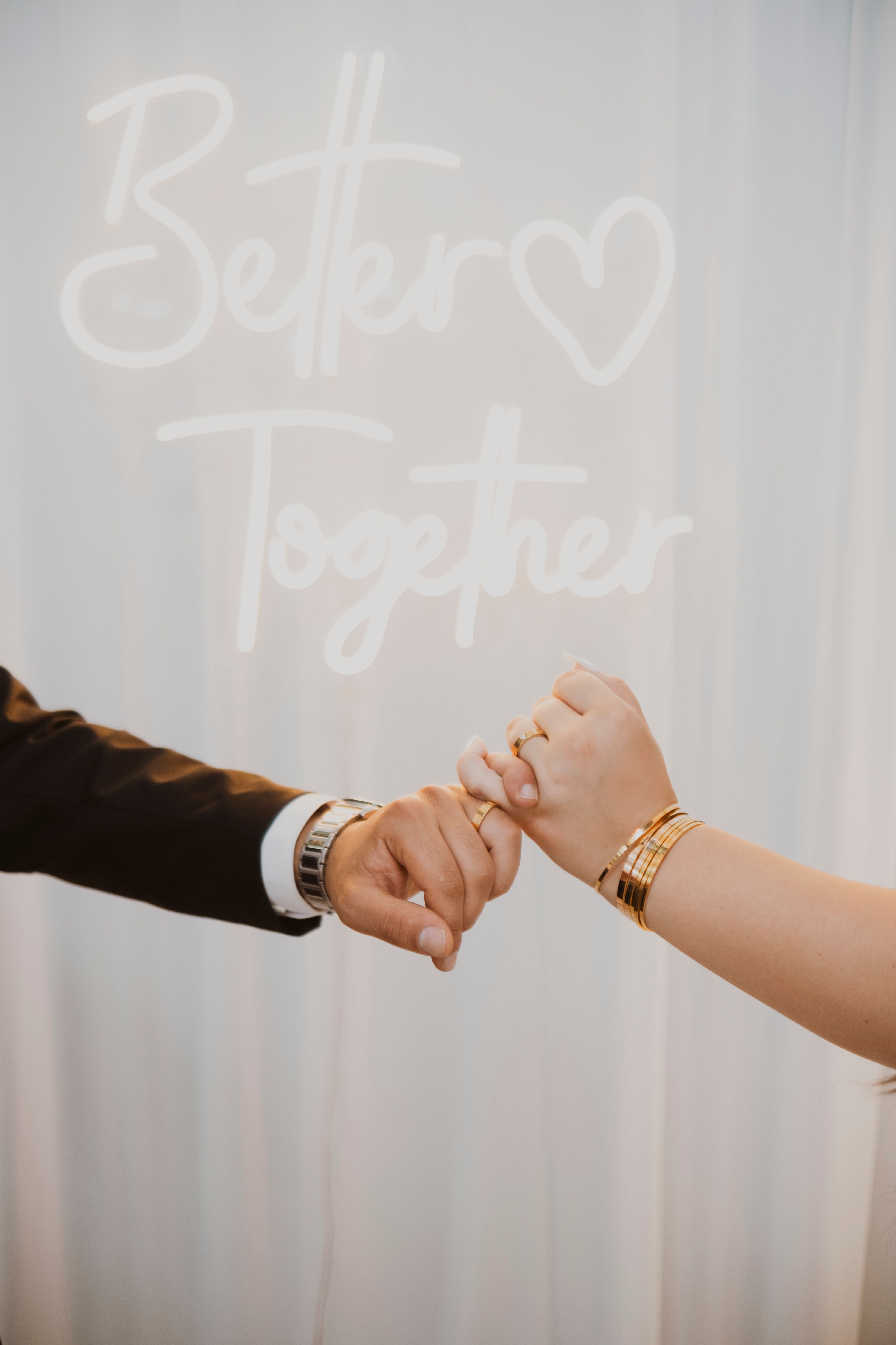 Hands of Newlywed against Neon Better Together · Free Stock Photo