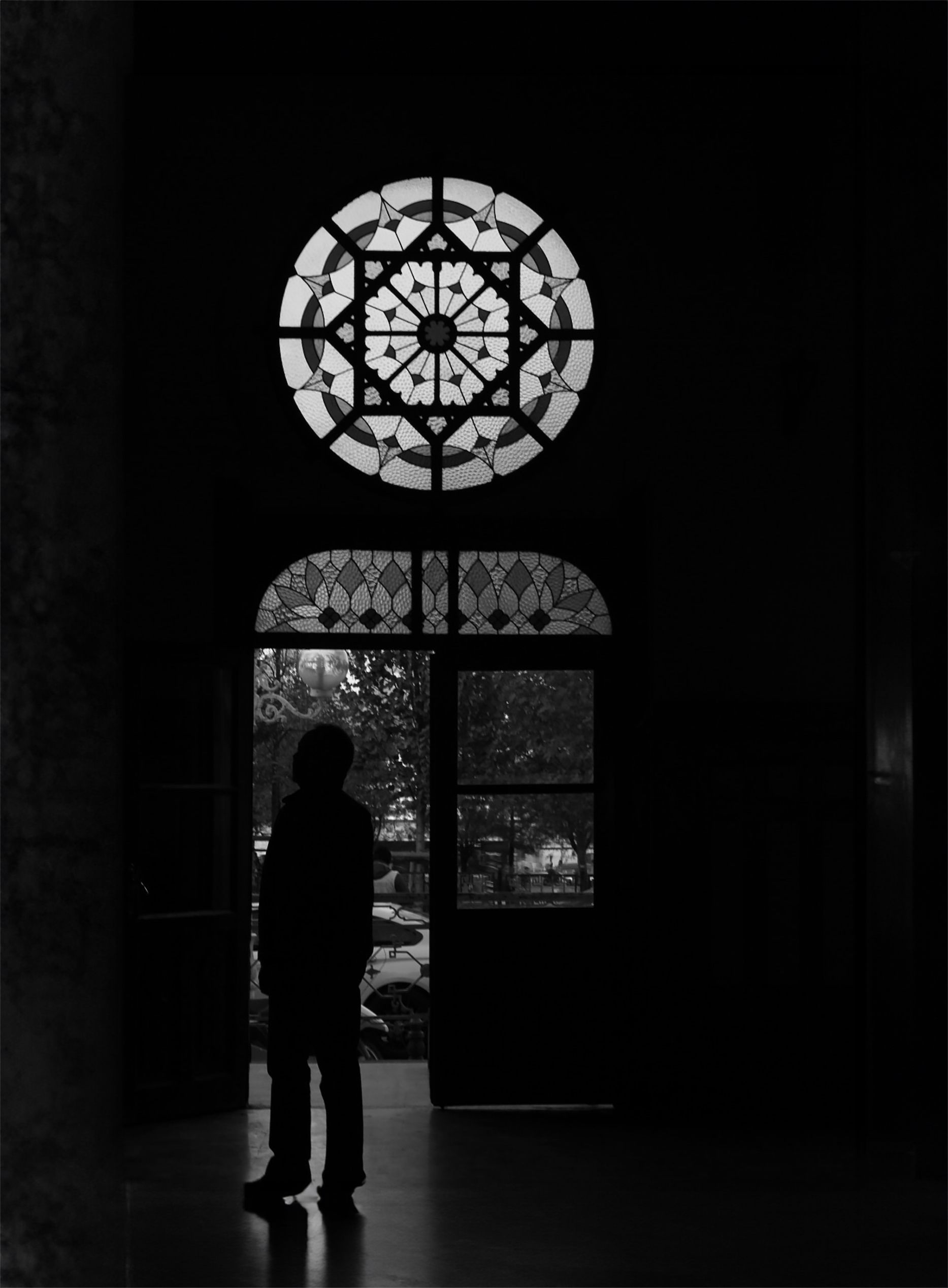 Man Standing in Darkness near Doors and Windows · Free Stock Photo