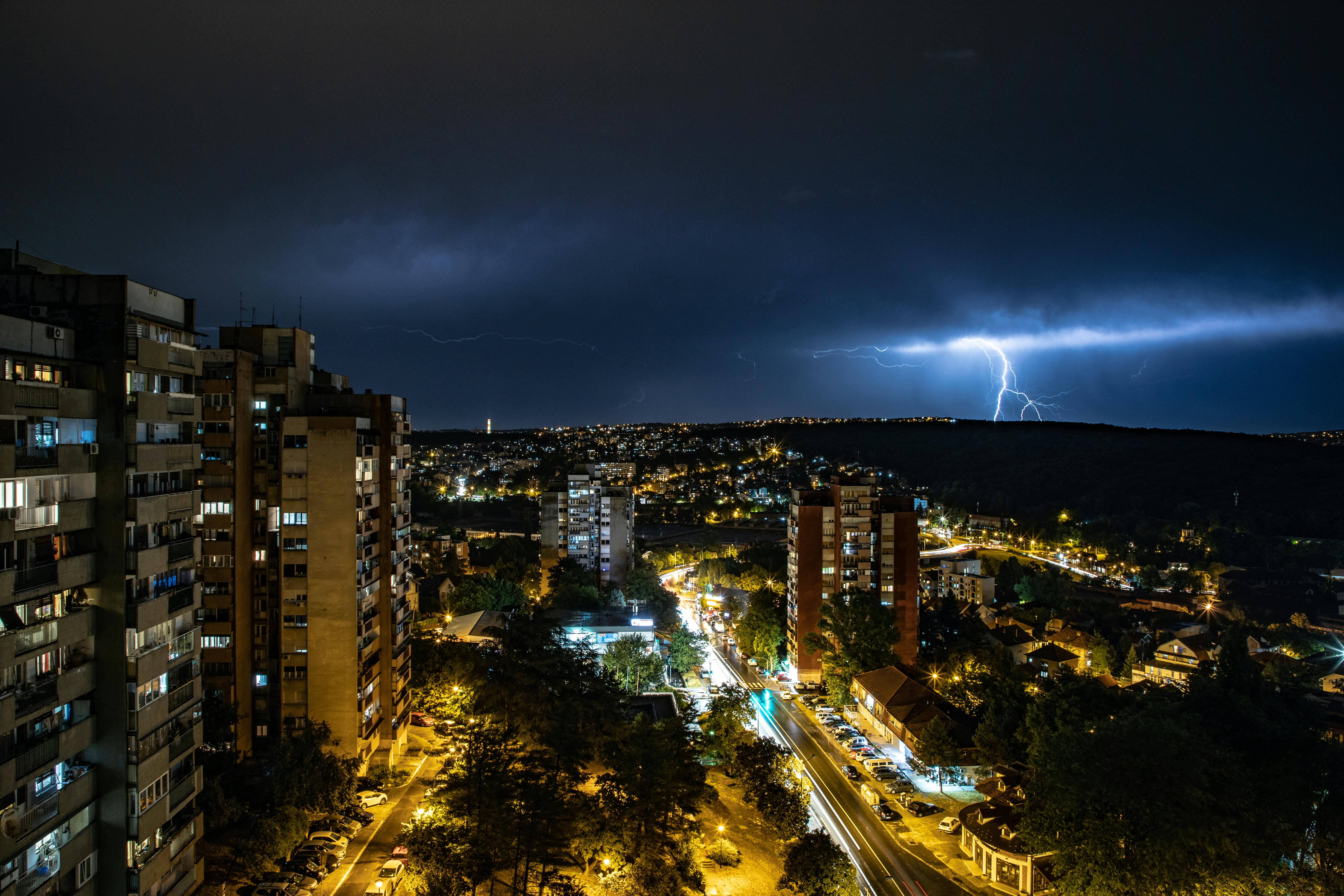 Thunderstorms Above City during Night Time · Free Stock Photo