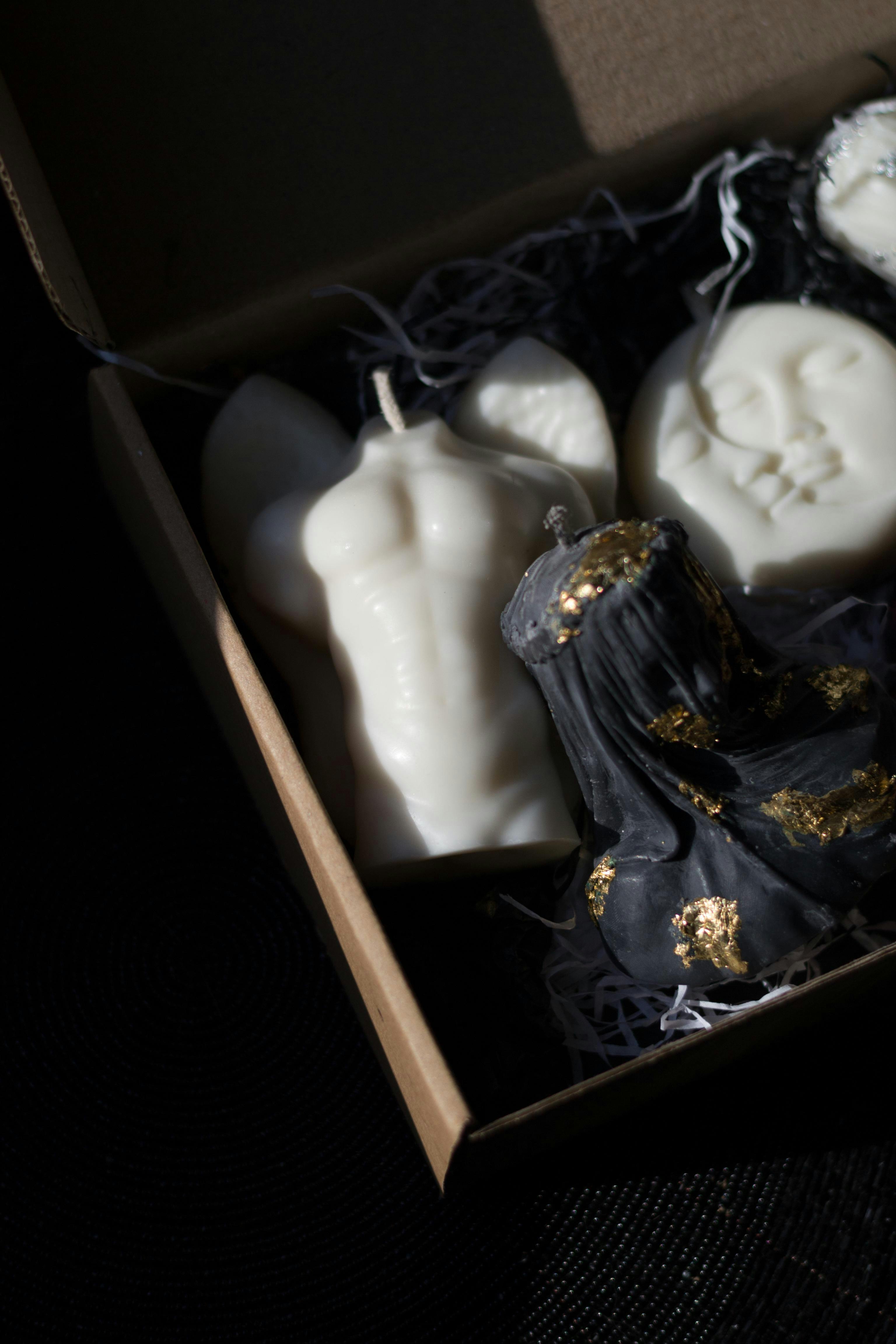 Decorative Scented Candles in a Cardboard Box · Free Stock Photo